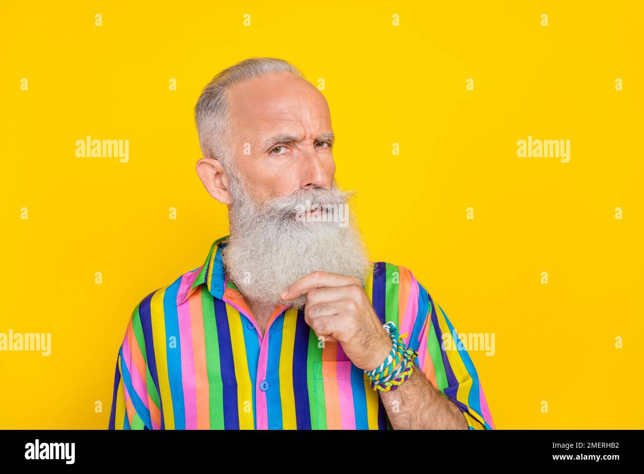 Photo of serious handsome nice man with white beard dressed striped ...