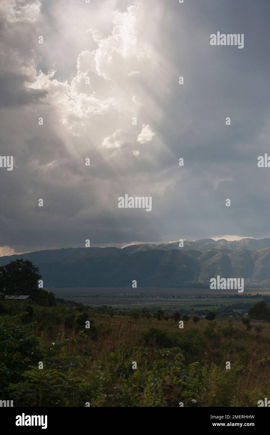 Myanmar, Eastern Burma, Inle Lake, sunlight breaking through clouds ...