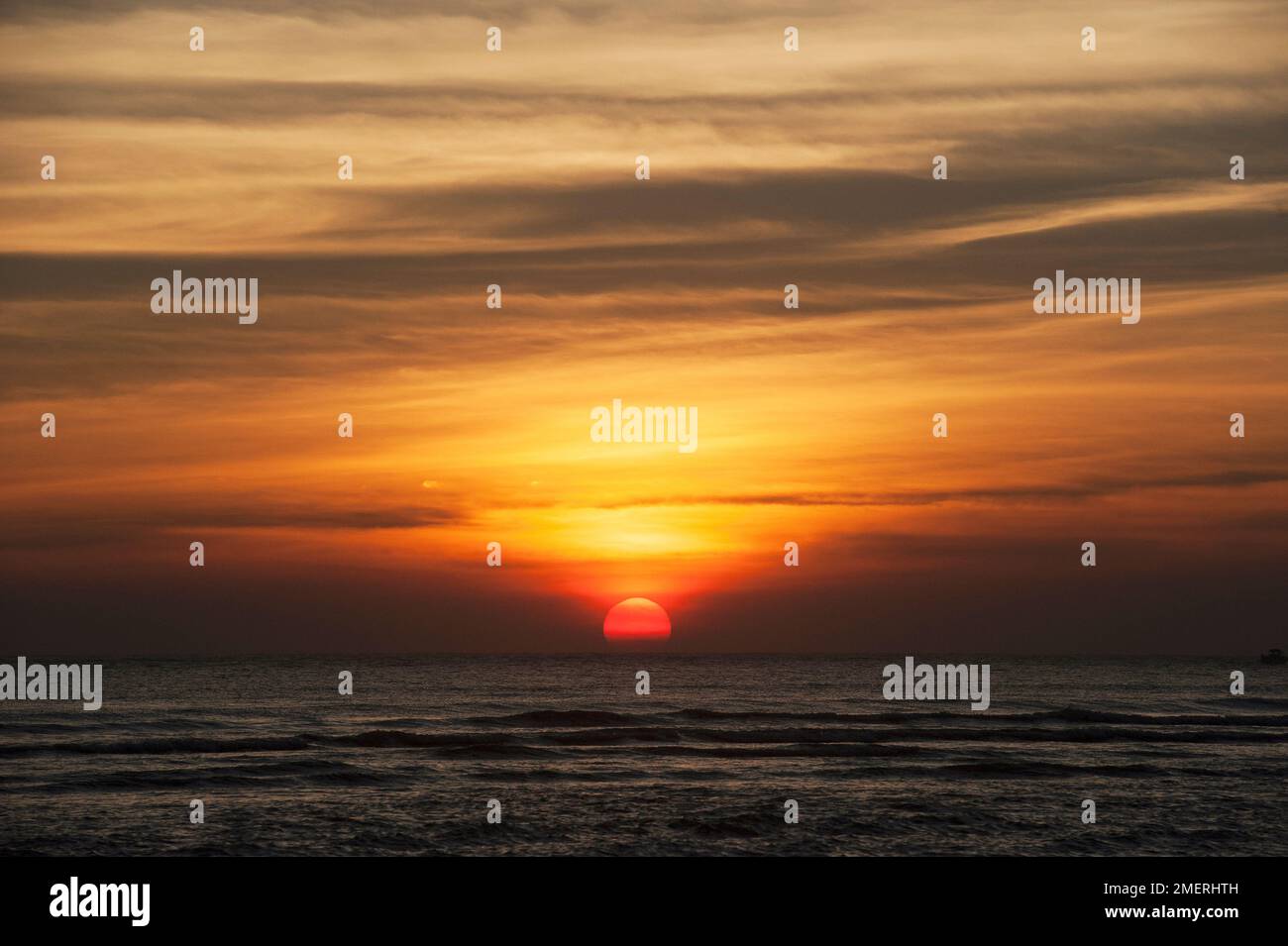 Myanmar, Western Myanmar, Sittwe, dramatic sunset seen from beach Stock ...
