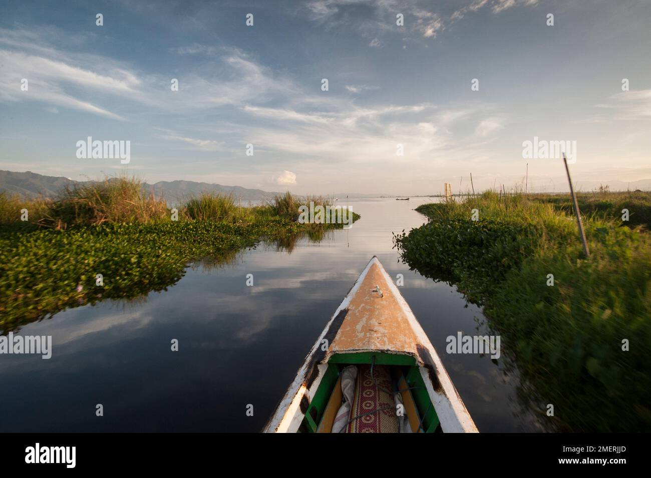 Myanmar, Eastern Myanmar, Inle Lake, long tailed boat on lake and ...