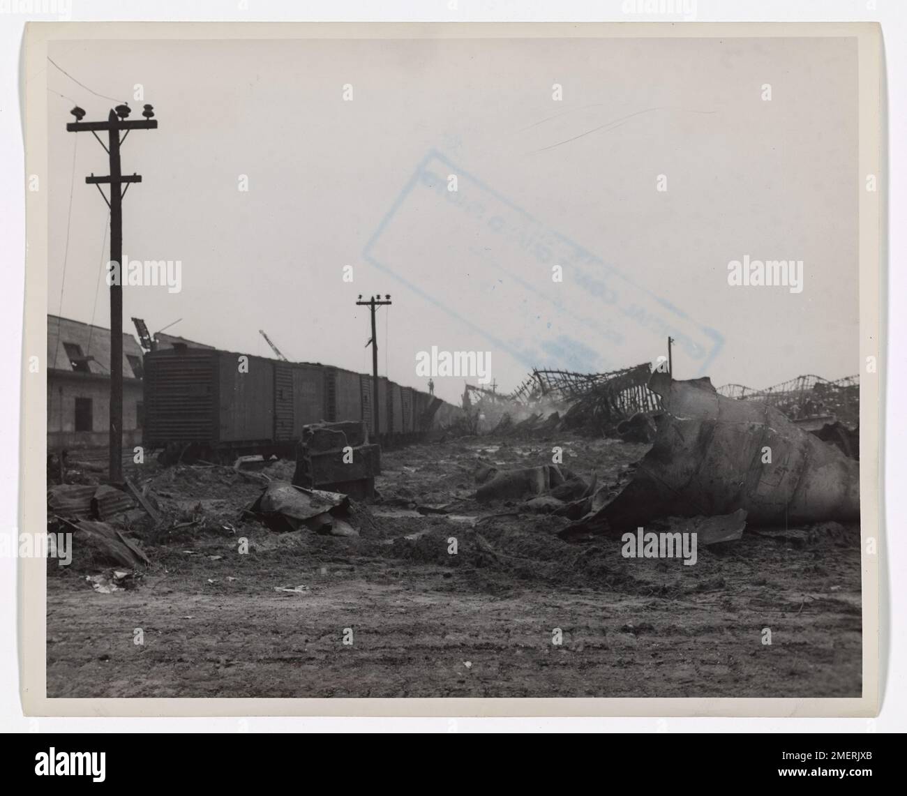 The aftermath of the Grandcamp explosion is shown, with twisted pieces ...