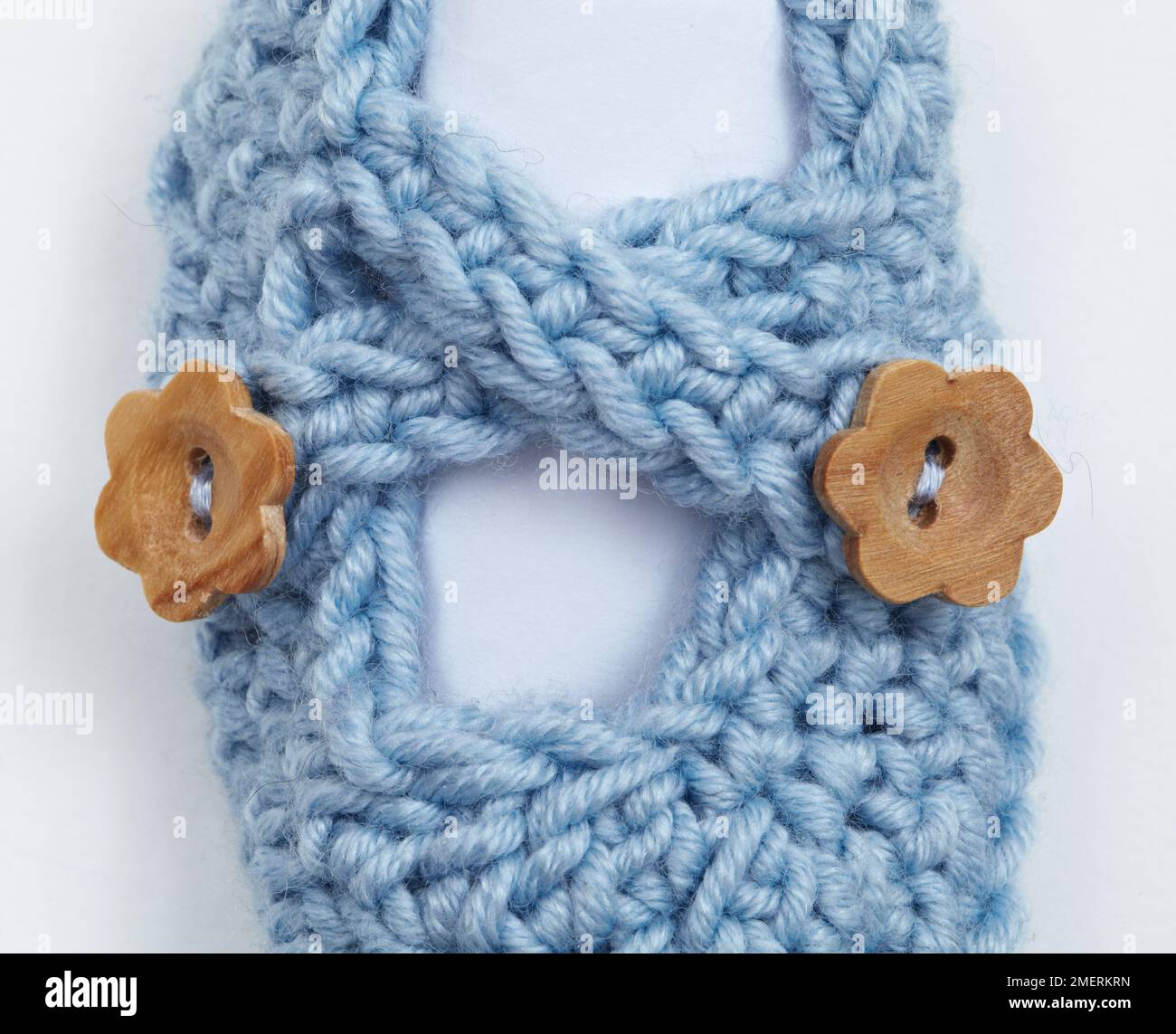 Crocheted baby's booties with wood buttons Stock Photo - Alamy