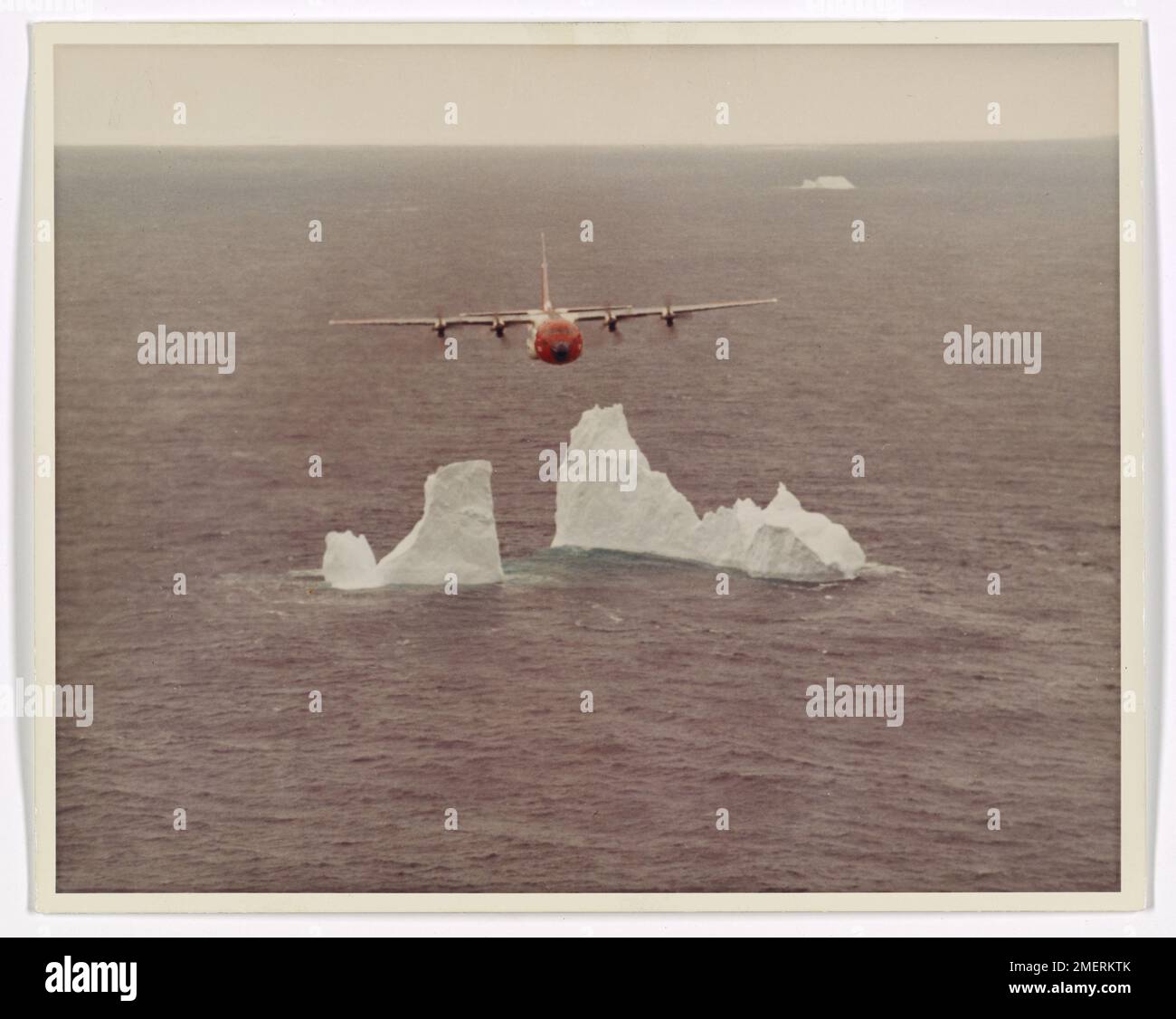 The Coast Guard HC-130-B Ice Patrol plane conducts a low-level flyover ...