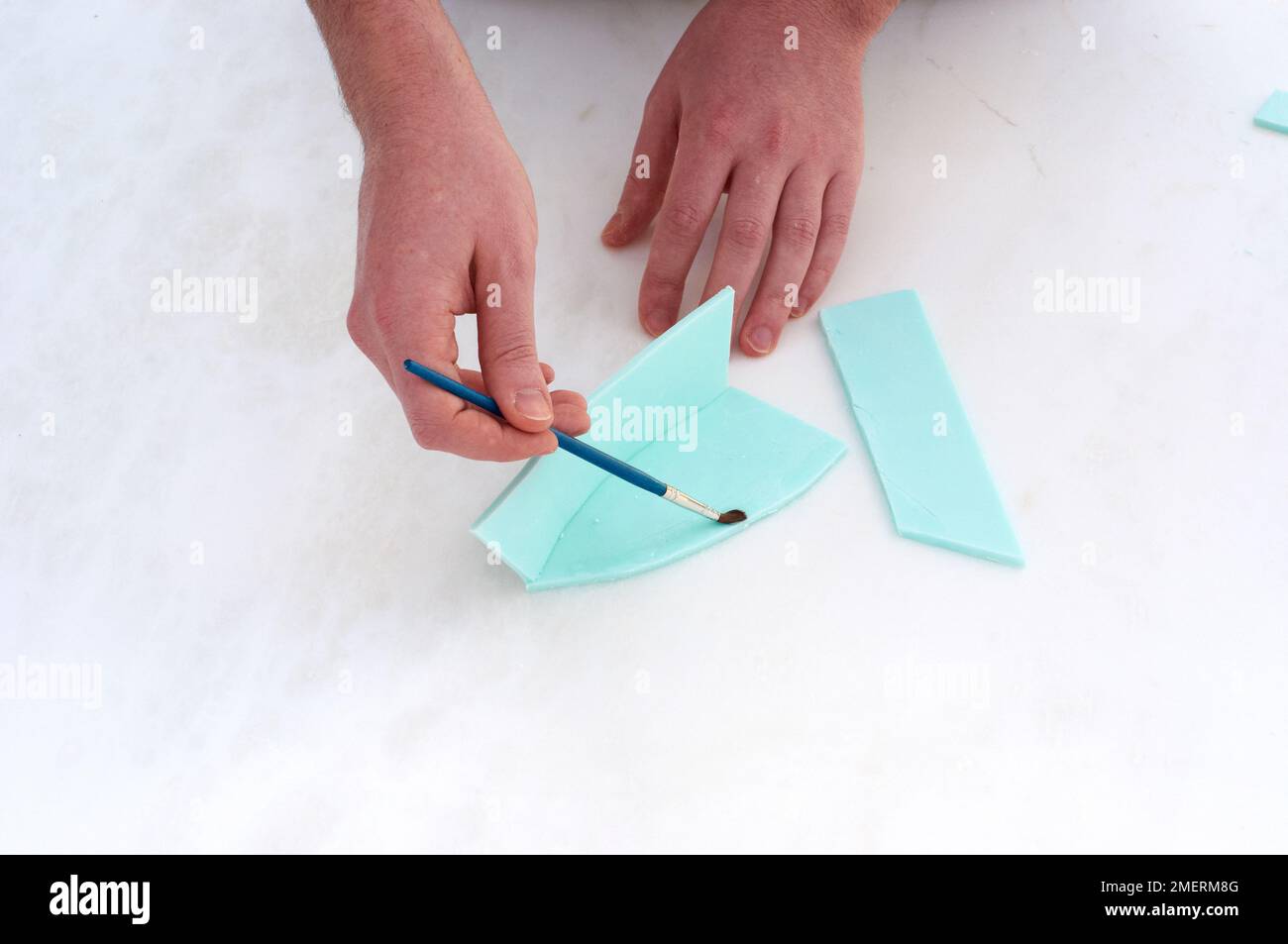 Modelling boat shape from fondant icing Stock Photo - Alamy