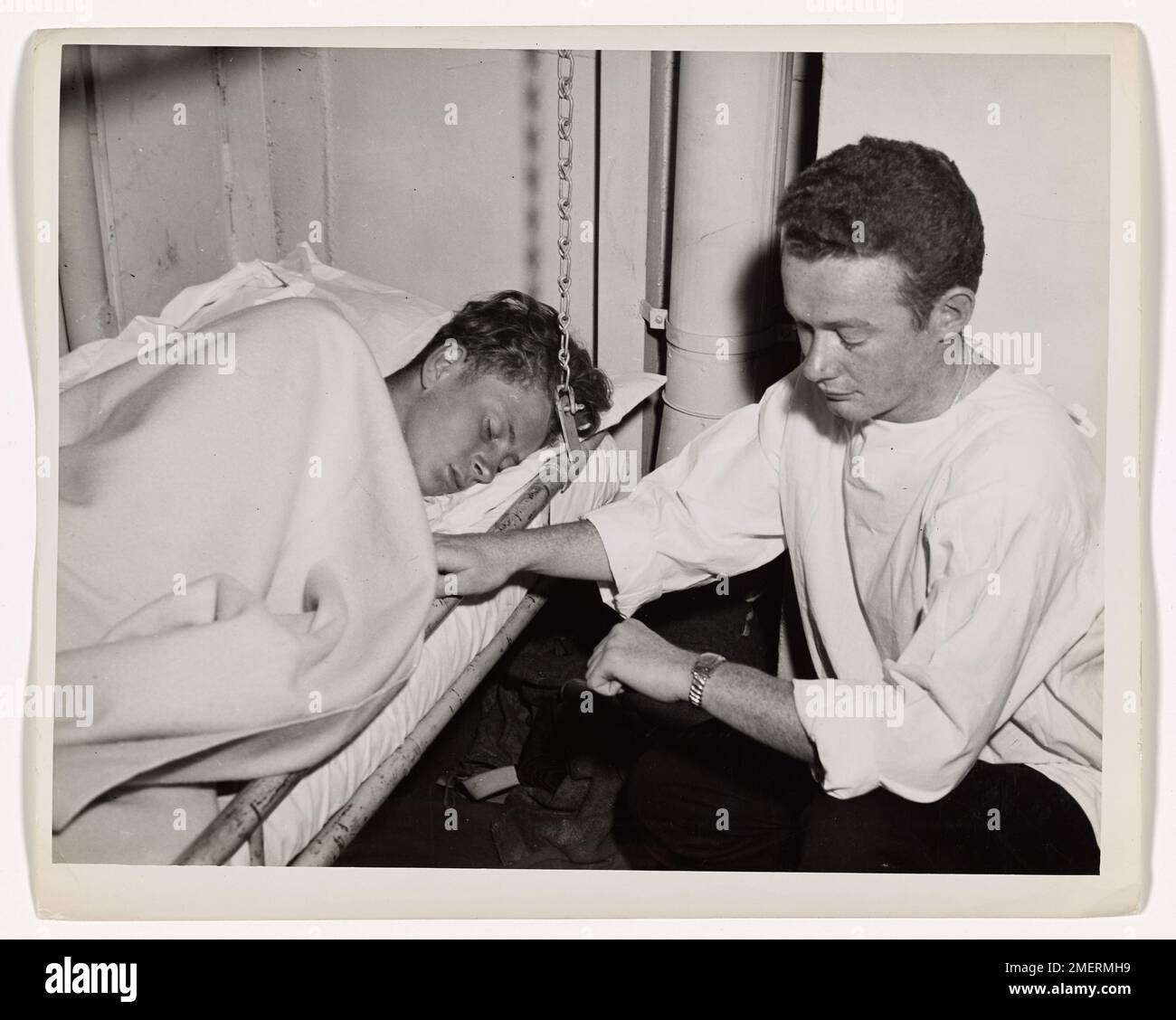 This photograph depicts a wounded Nazi prisoner, one of the first ...