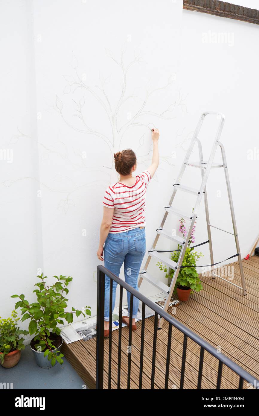 Drawing tree design on outer wall Stock Photo - Alamy