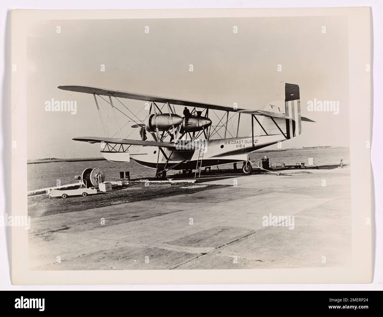 A U.S. Coast Guard V-164 aircraft is seen in flight, performing aerial ...
