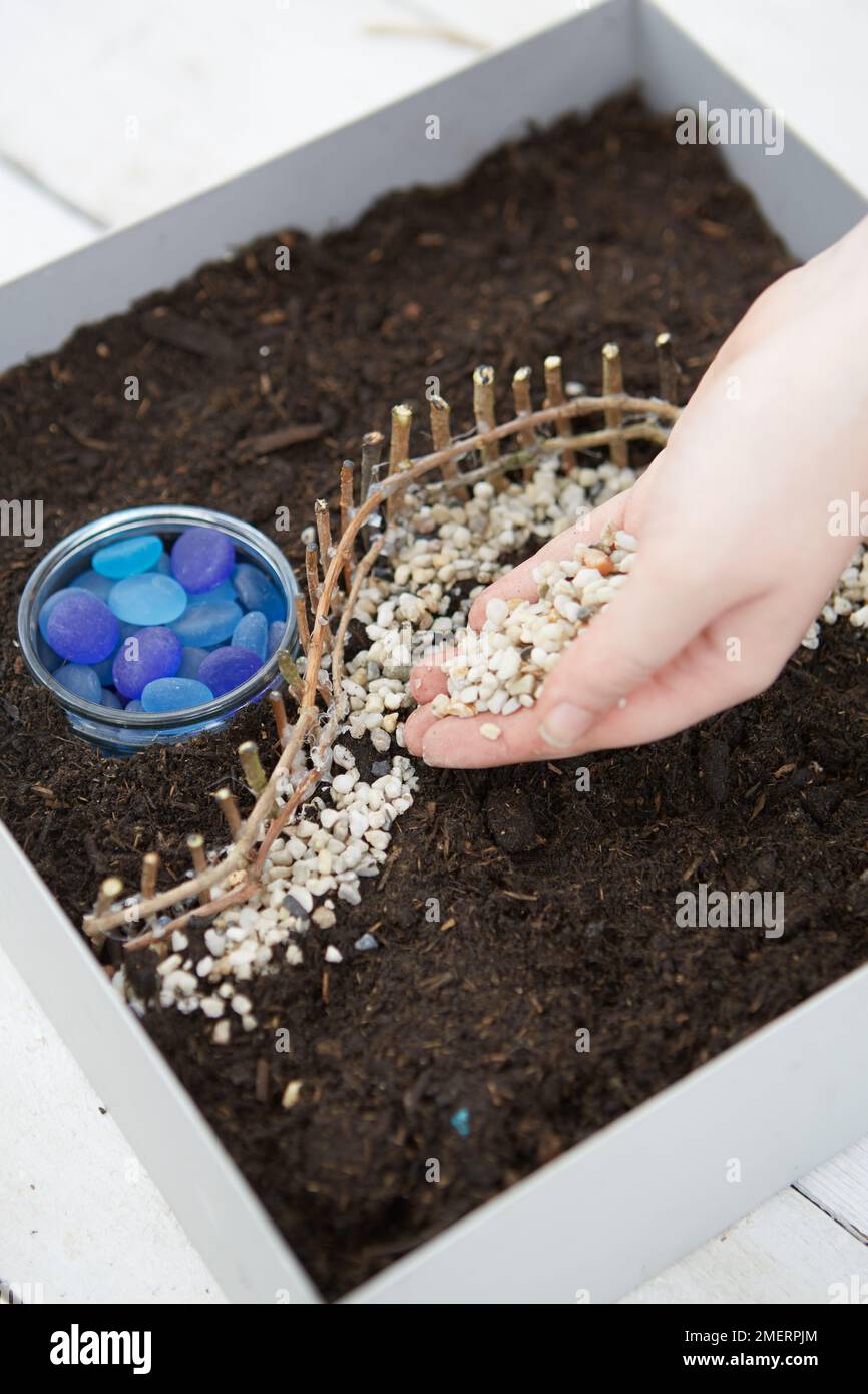 Making childrens' mini garden farm Stock Photo - Alamy