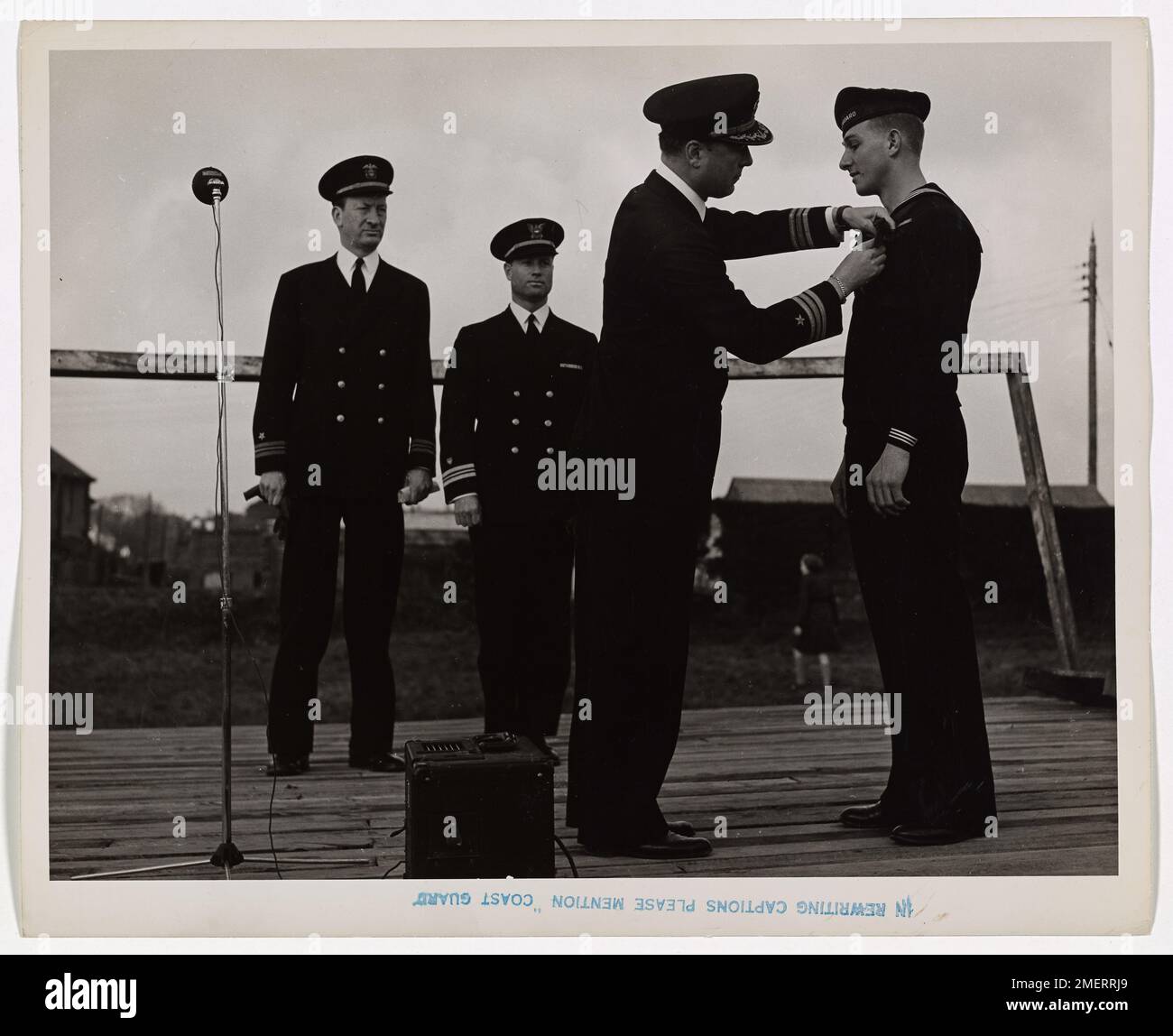 Grenade-throwing Coast Guardsman Decorated. His landing craft swept by ...