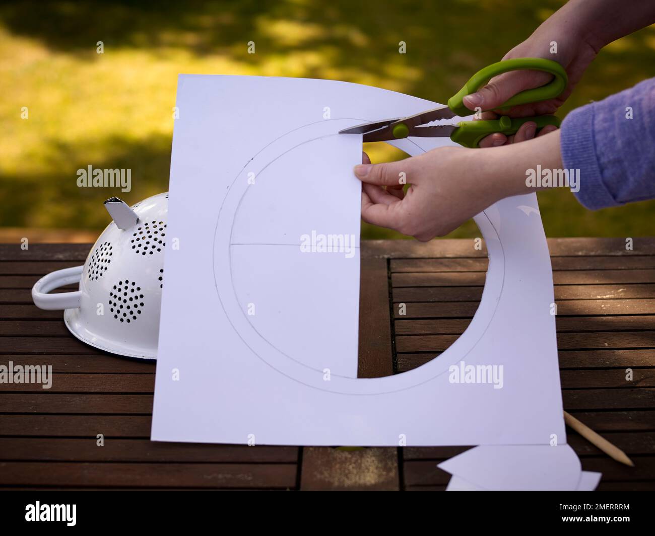 Drawing and cutting out a stencil design or template Stock Photo - Alamy
