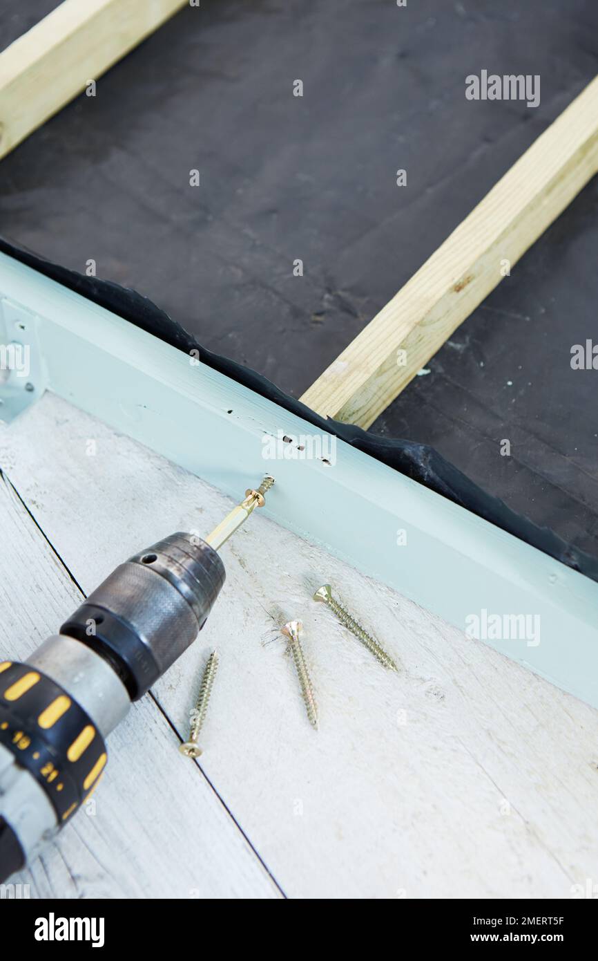 Securing baton inside living picture frame Stock Photo - Alamy