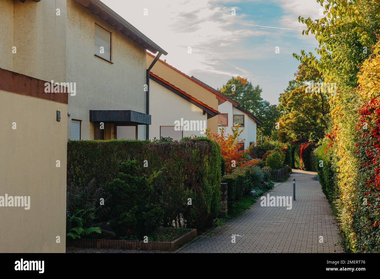 Old white cottage in cozy town. Street view landscape old city, little ...