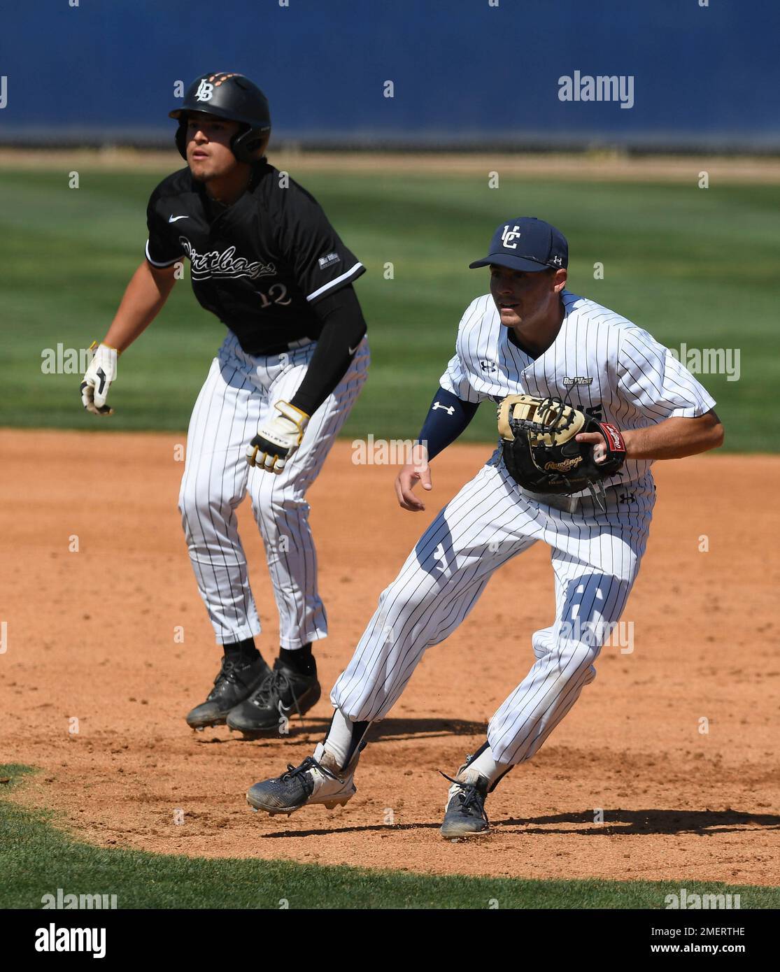 Long Beach's Calvin Estrada leads off first base in front of UC San ...