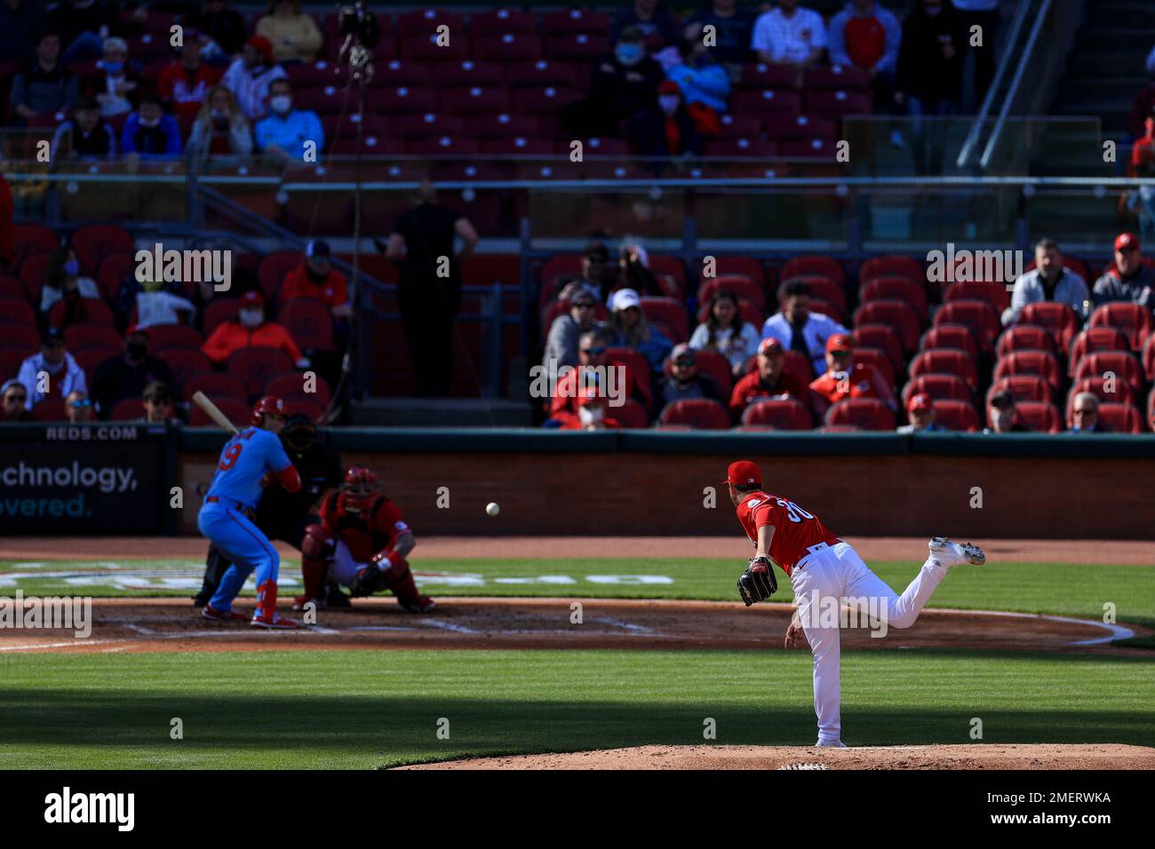 Cincinnati Reds' Tyler Mahle, right, throws during the third inning of ...