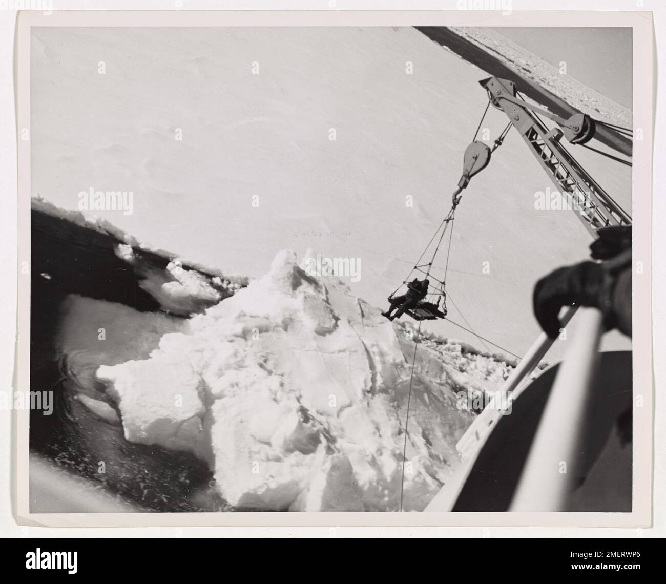 Coast Guard photographer Elmo Jones is seen working from a crane on the ...