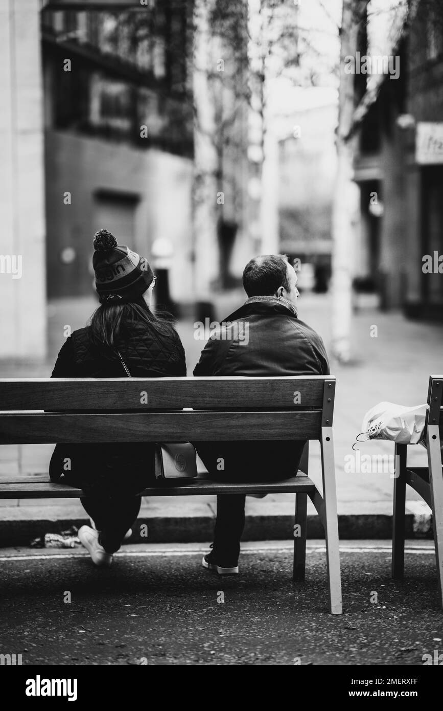 Woman sitting on bench back view Black and White Stock Photos & Images ...