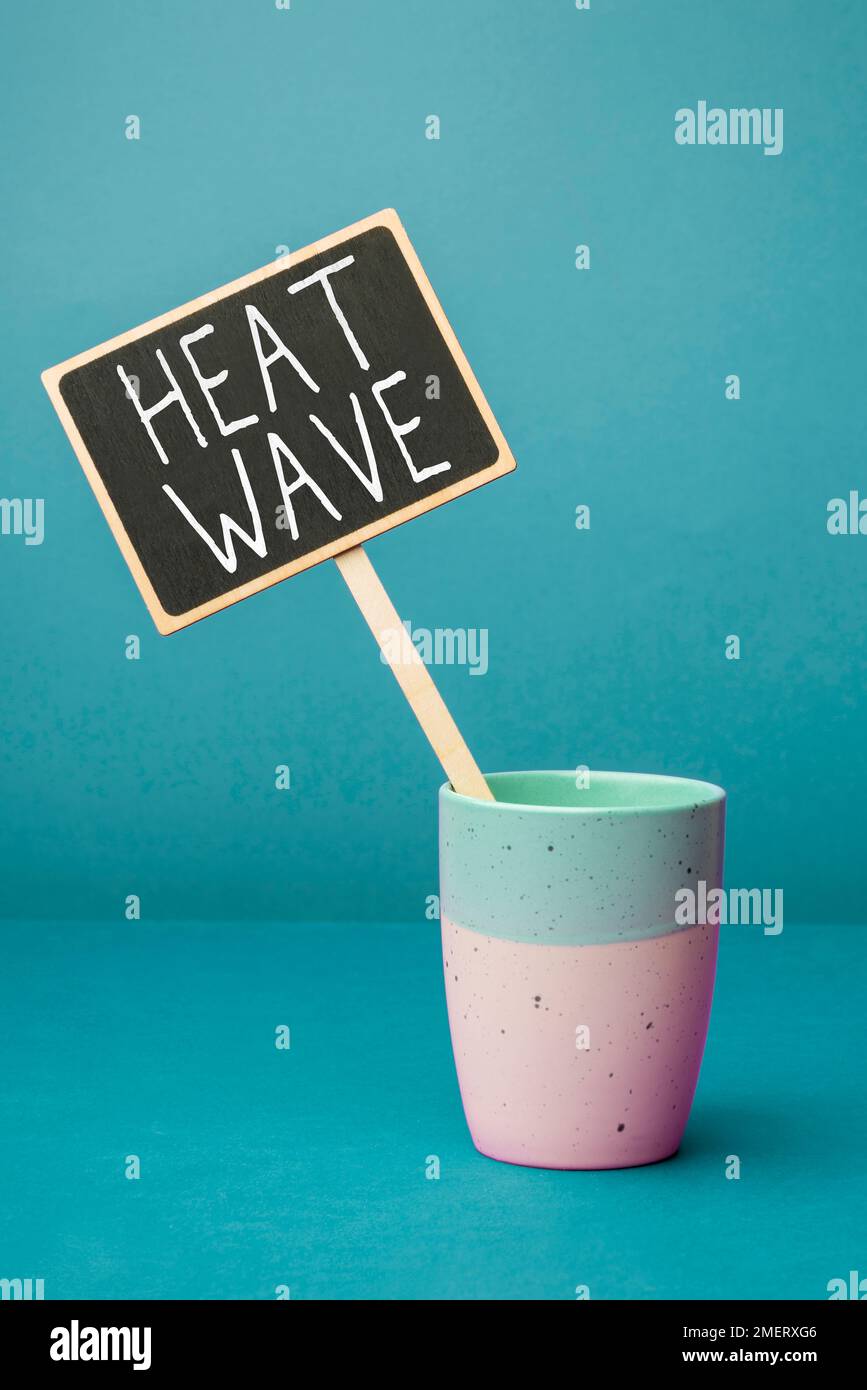 Hand writing sign Heat Wave. Word Written on a prolonged period of ...