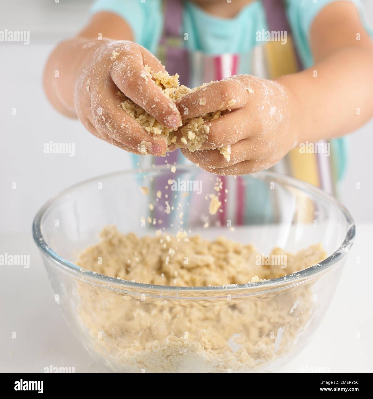 Girl making cookie dough mixture from butter and flour Stock Photo - Alamy
