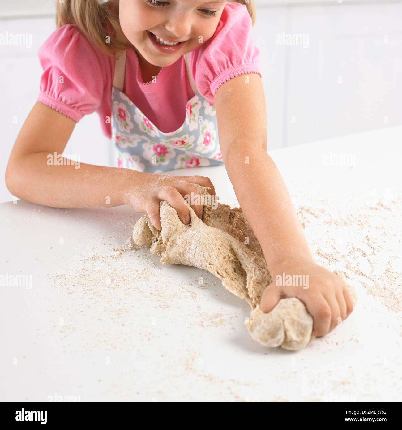 Girl tearing bread dough, 5 years Stock Photo - Alamy