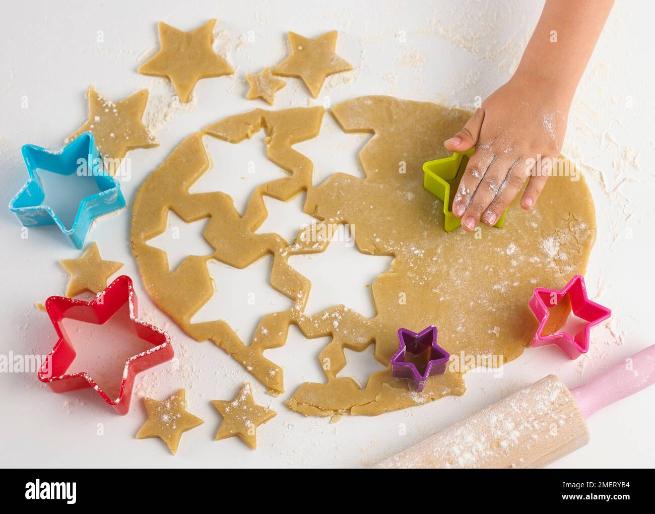 Cutting star shapes from cookie dough Stock Photo - Alamy