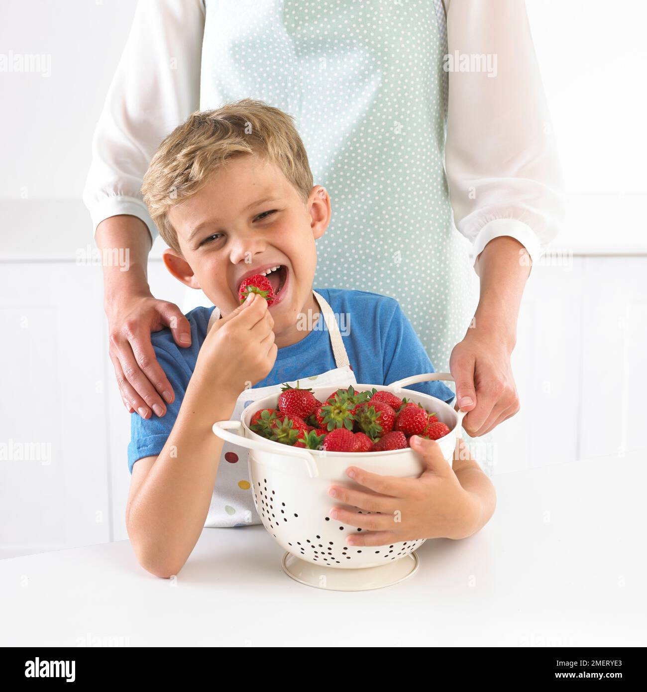Boy eating berries hi-res stock photography and images - Alamy