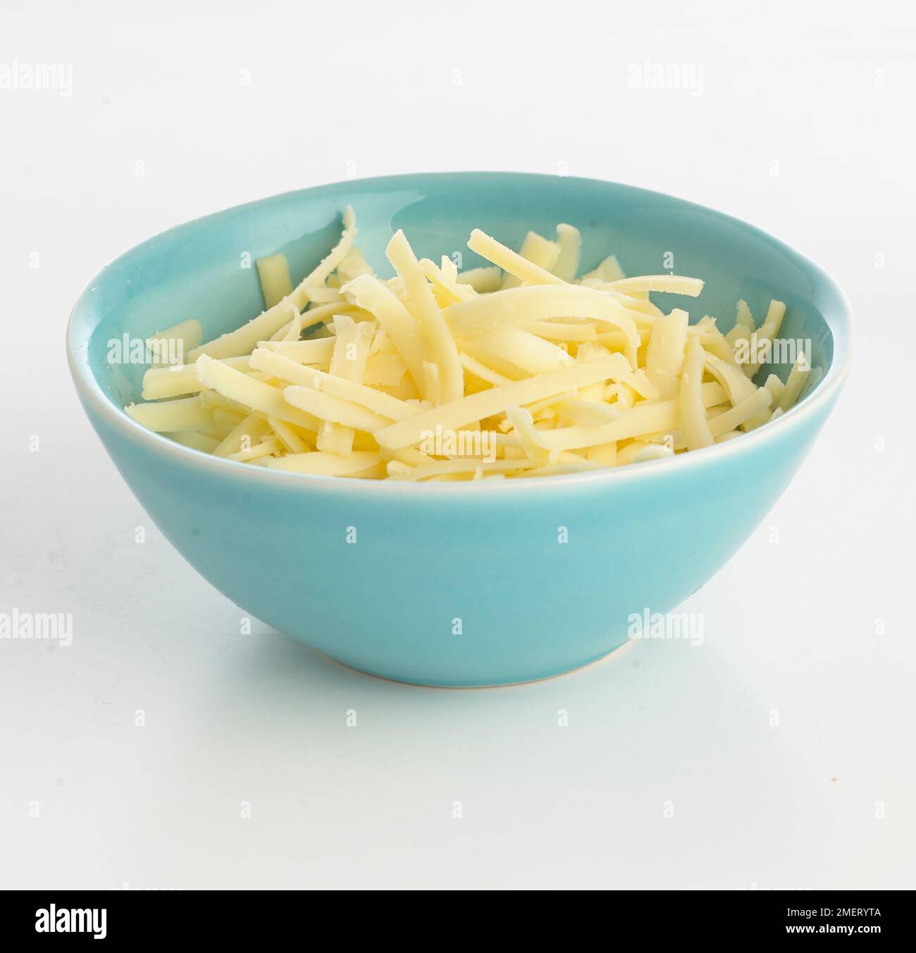 Bowl of grated cheese Stock Photo - Alamy