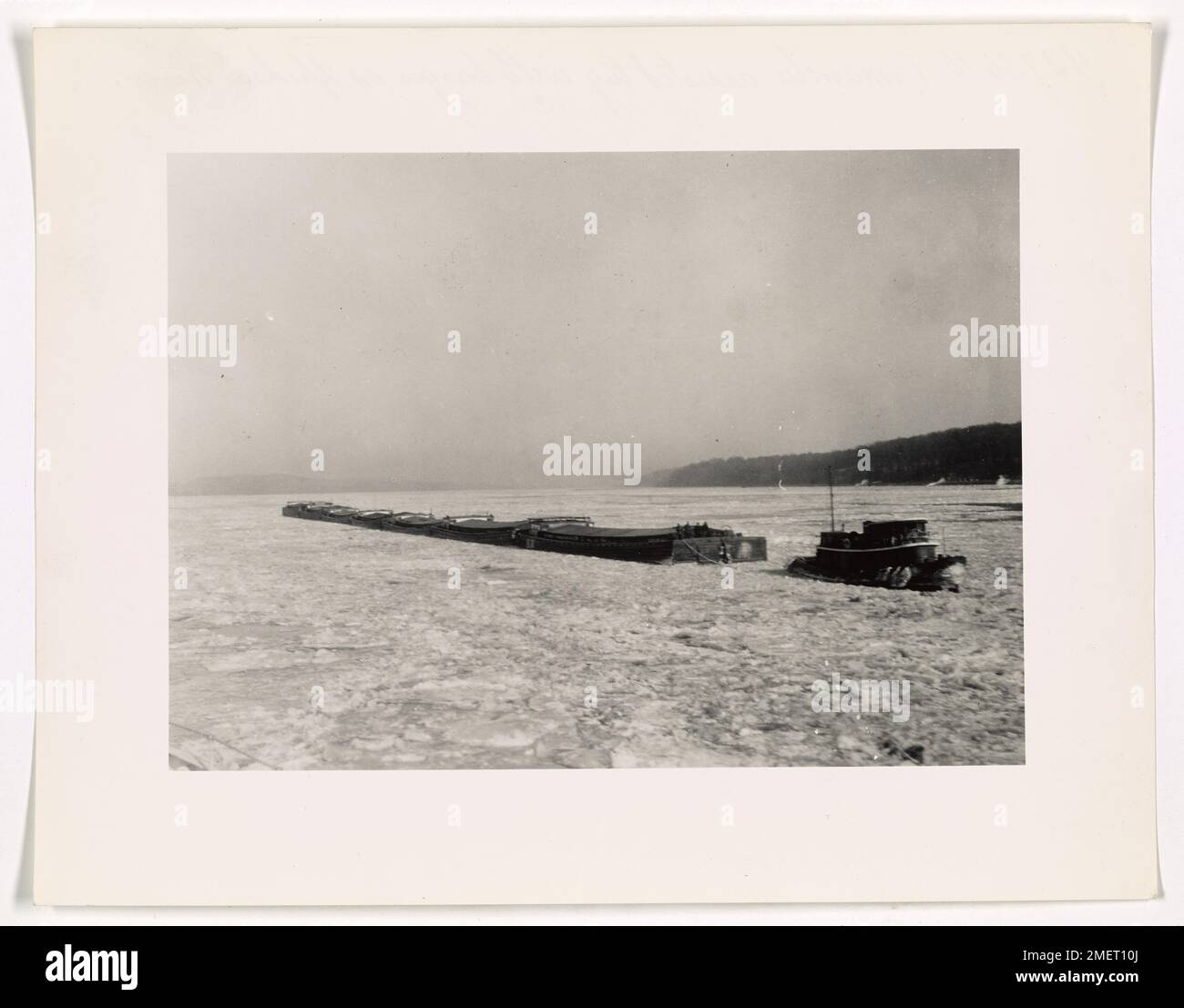 A Comanche-assisted tug moves barges along the Hudson River ...