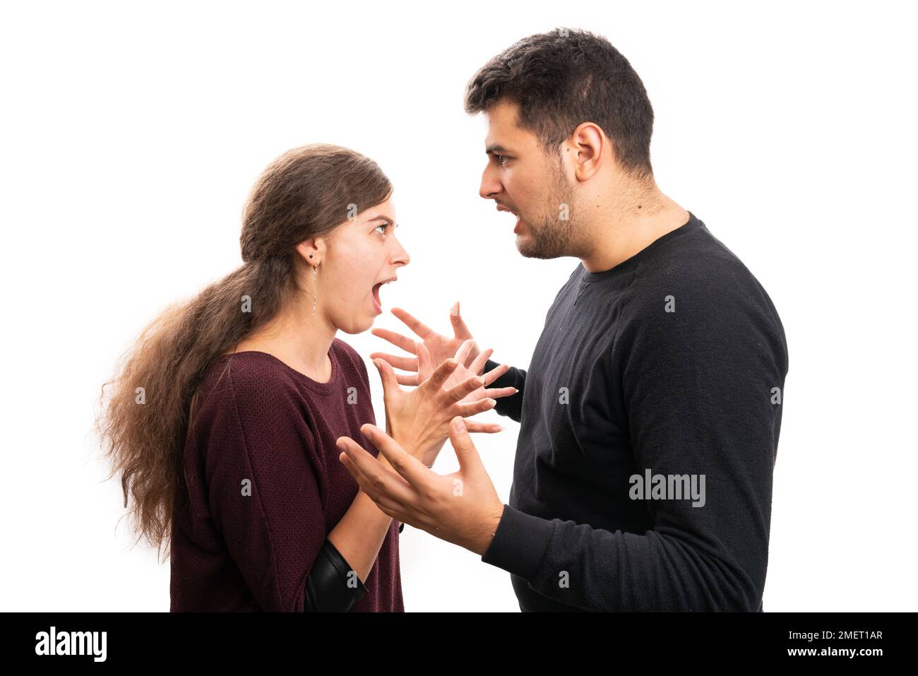 Male and female couple wearing casual autumn attire arguing shouting ...