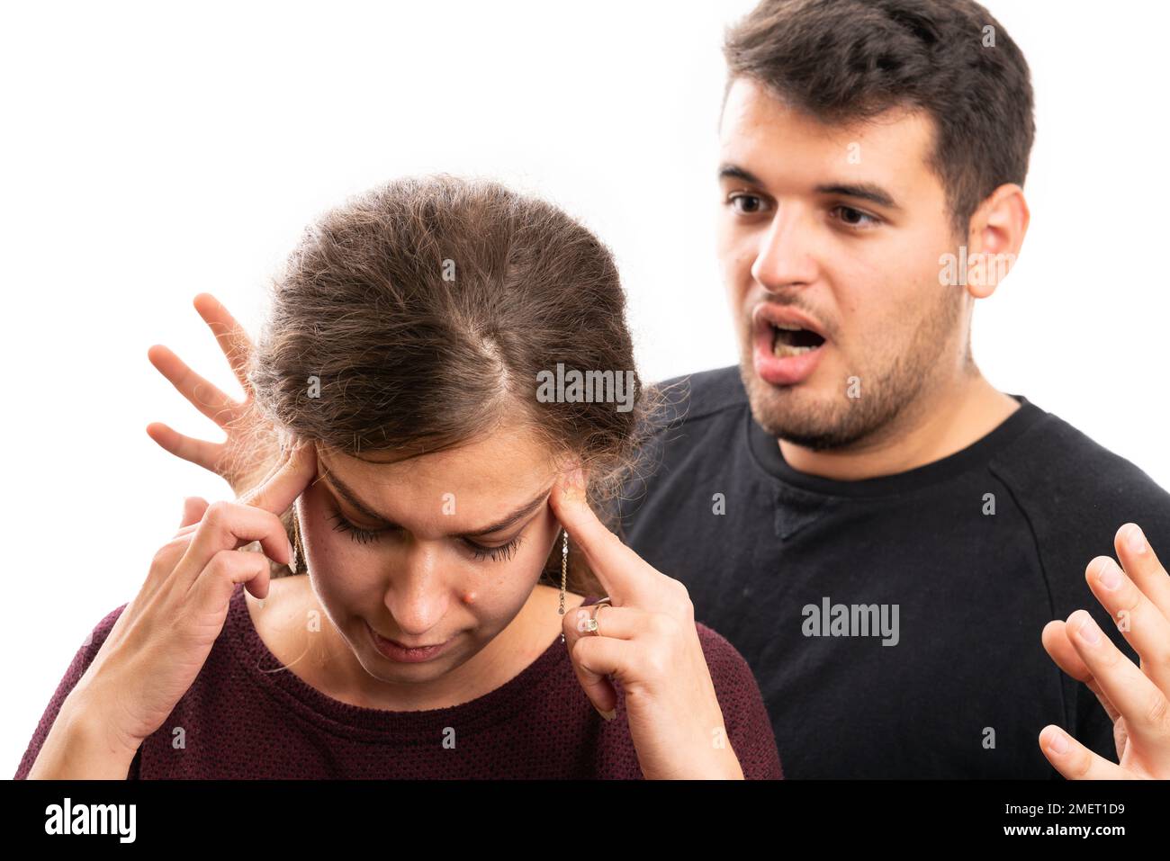 Close-up of adult woman with headache angry as boyfriend shouting at ...