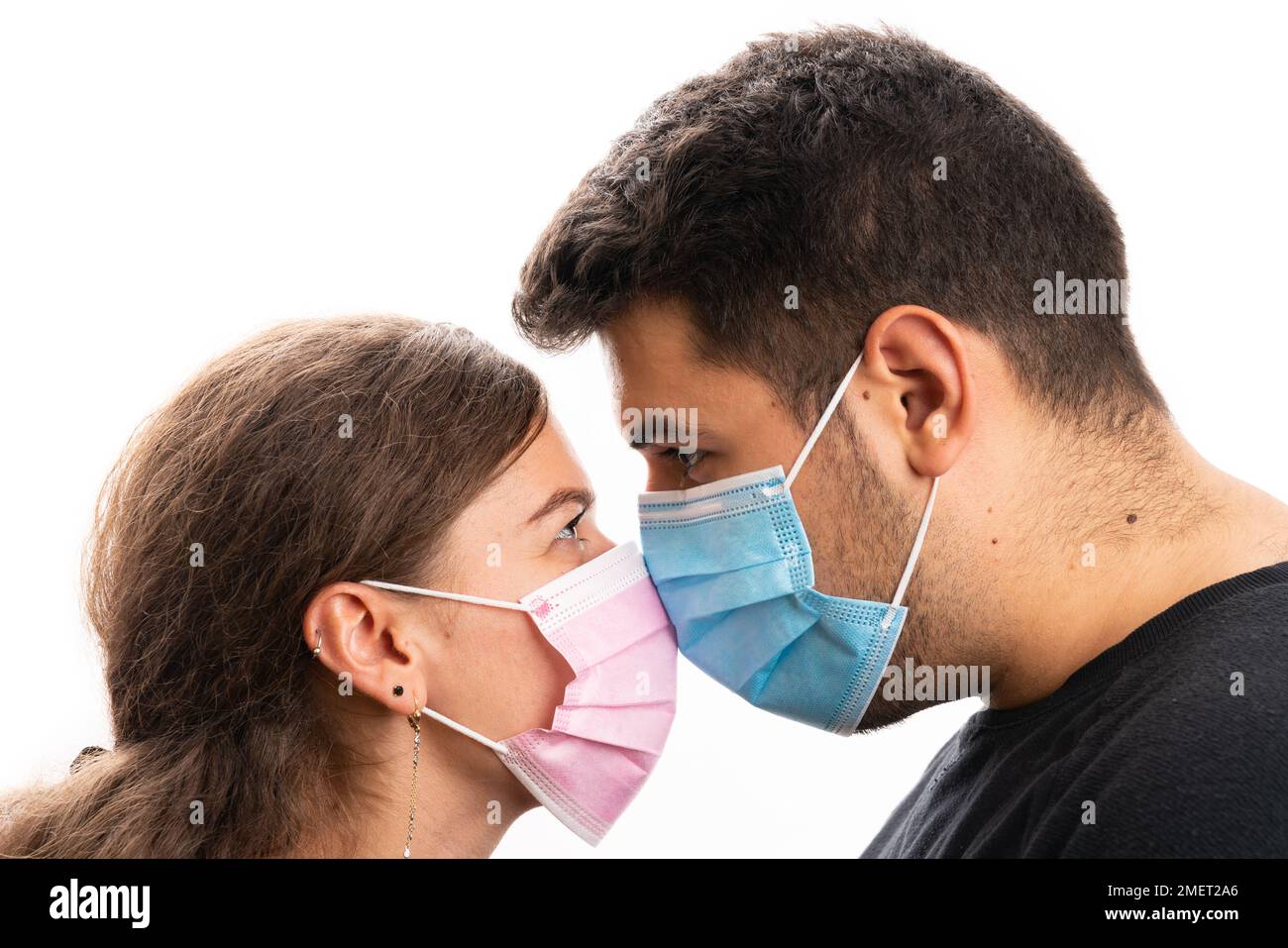 Close-up of female male couple wearing pink and blue medical or ...