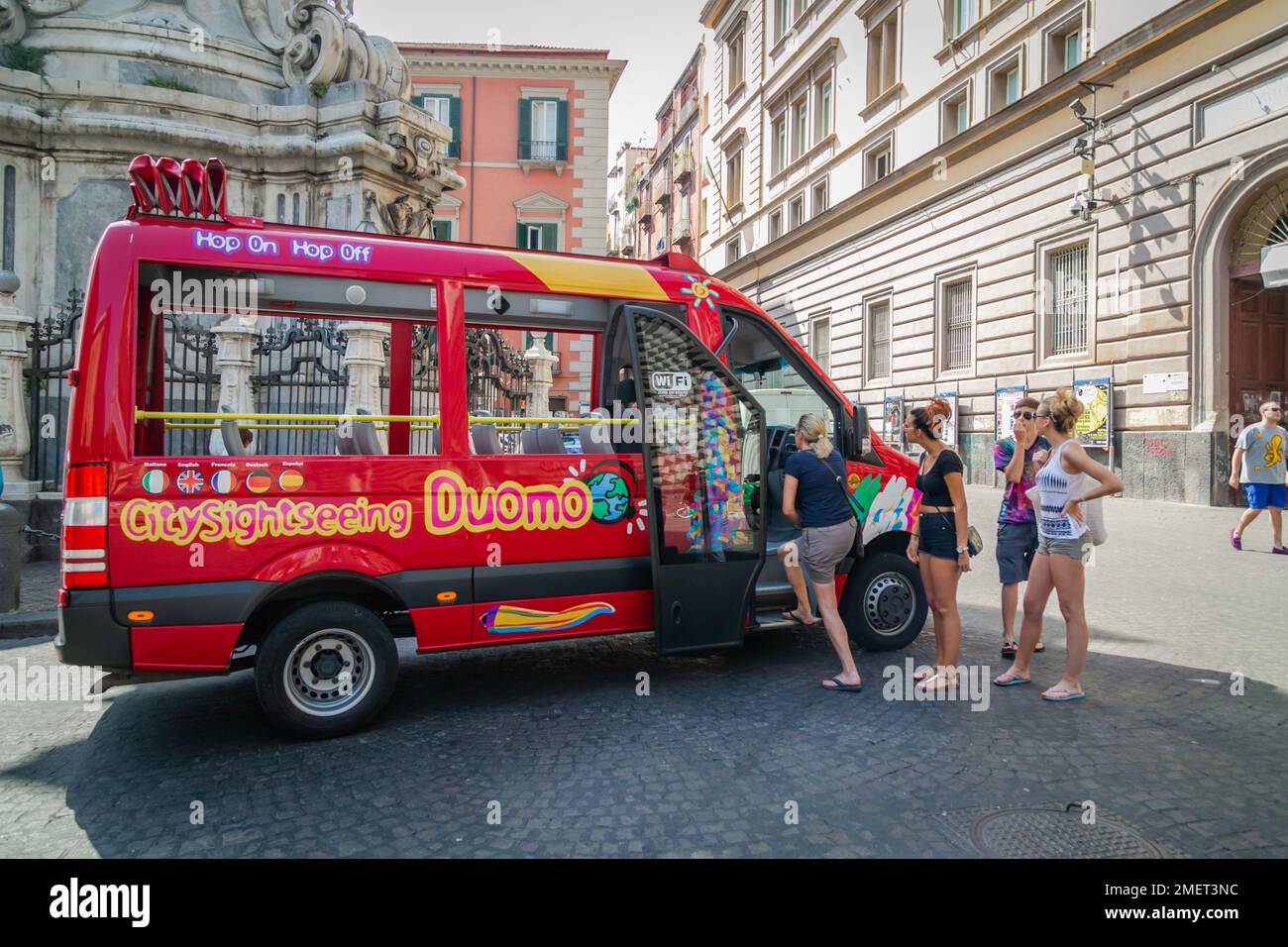 Tourists boarding sightseeing bus in Naples, Italy Stock Photo - Alamy
