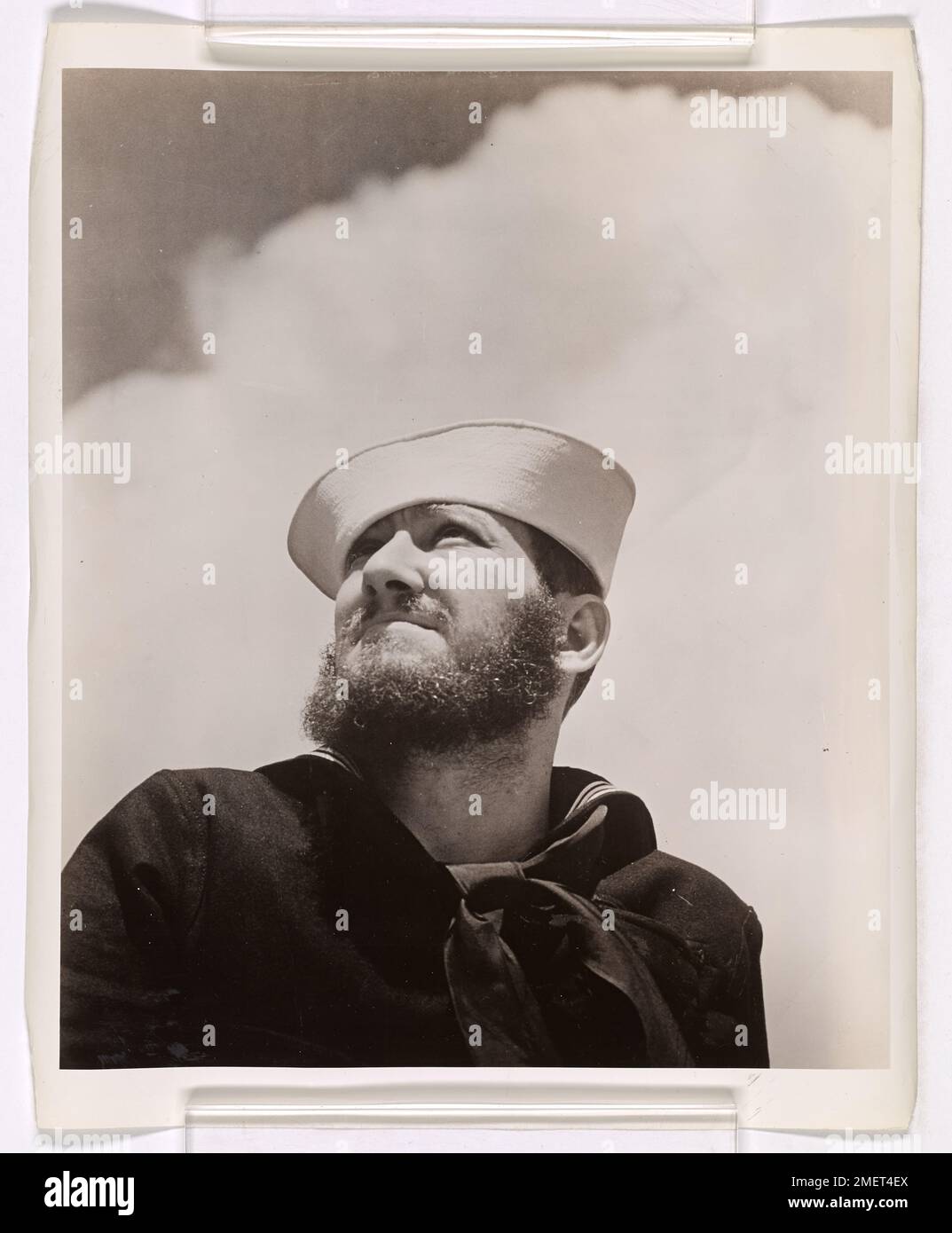 A U.S. Coast Guardsman monitors the skies for weather while performing ...