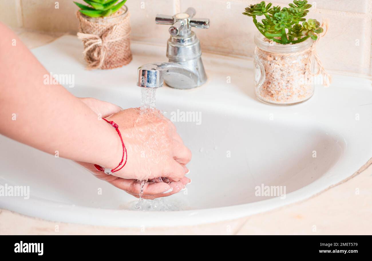 Close up of a person washing their hands with soap, concept of correct ...