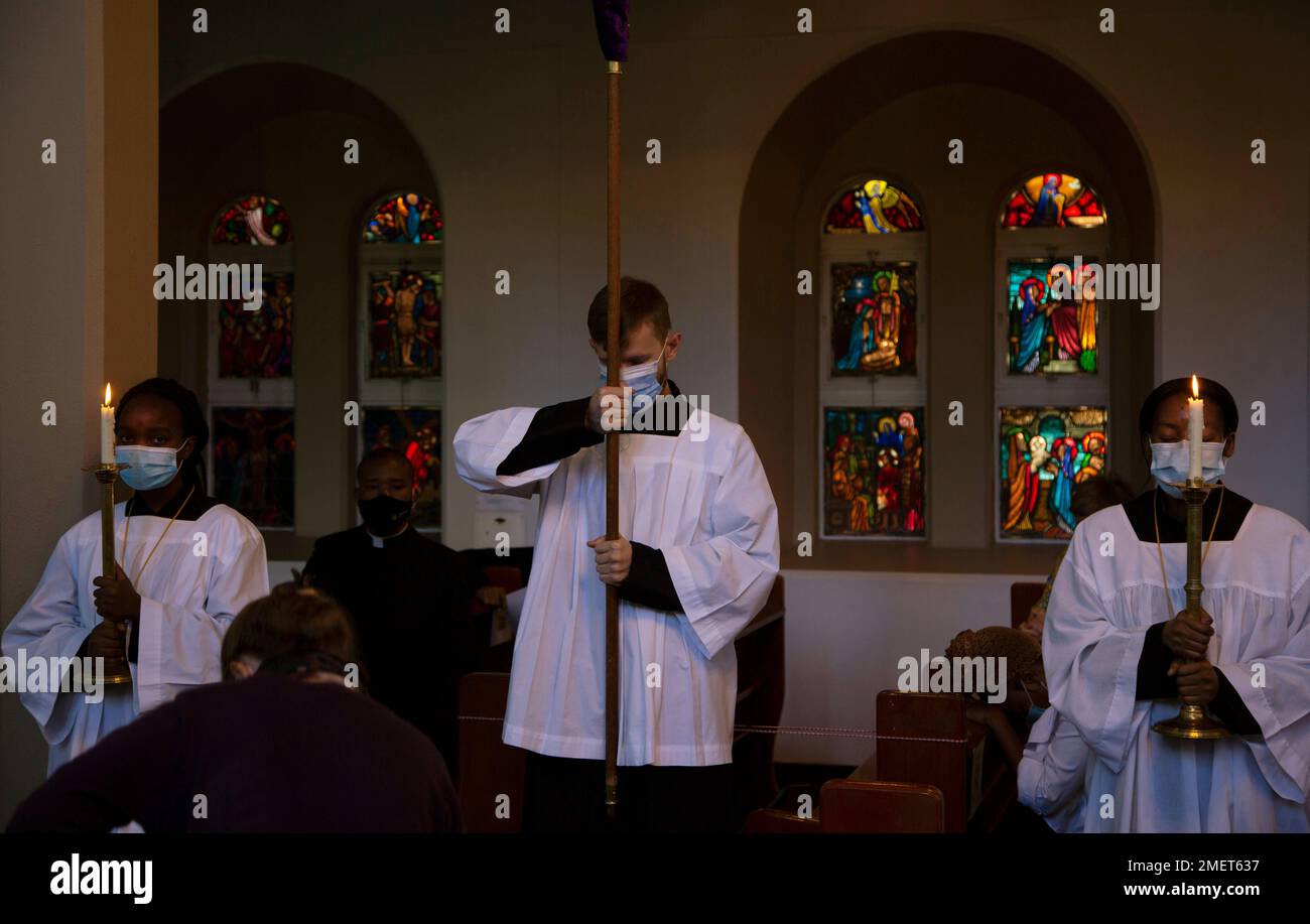 Servers take part in a Stations of the Cross service during the Good ...