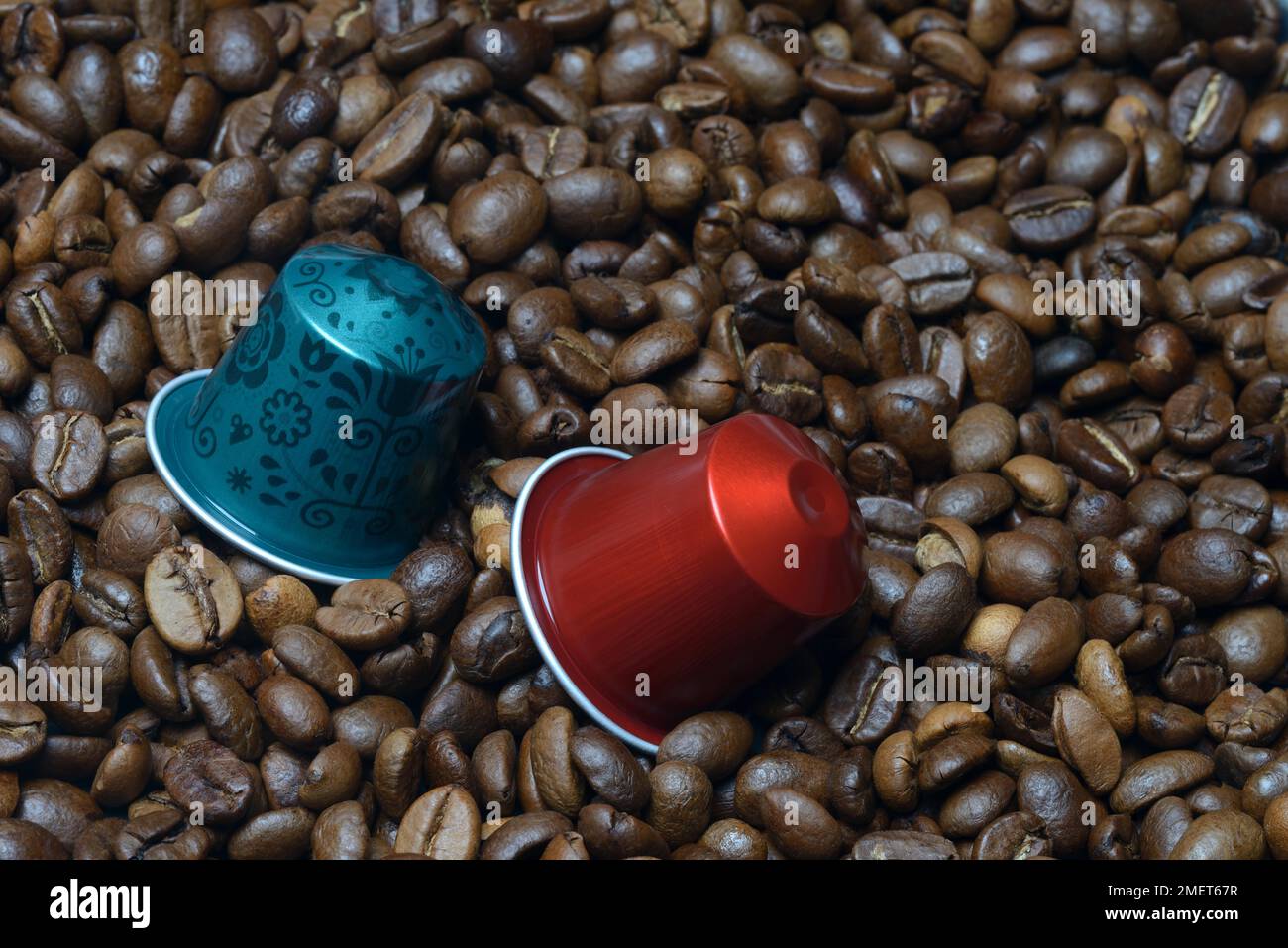Coffee capsules and coffee beans Stock Photo - Alamy