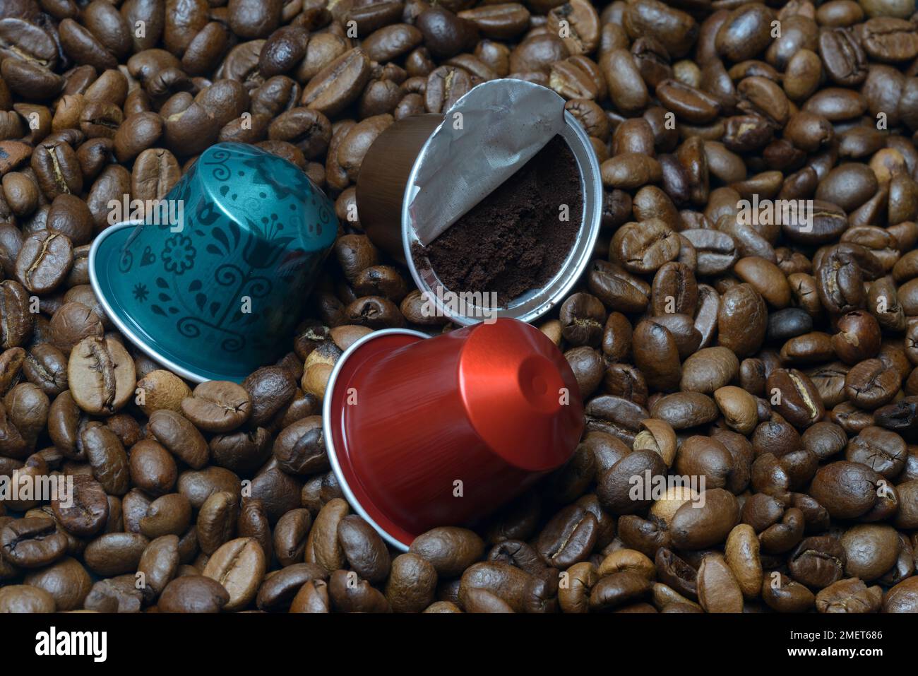 Coffee capsules and coffee beans Stock Photo - Alamy