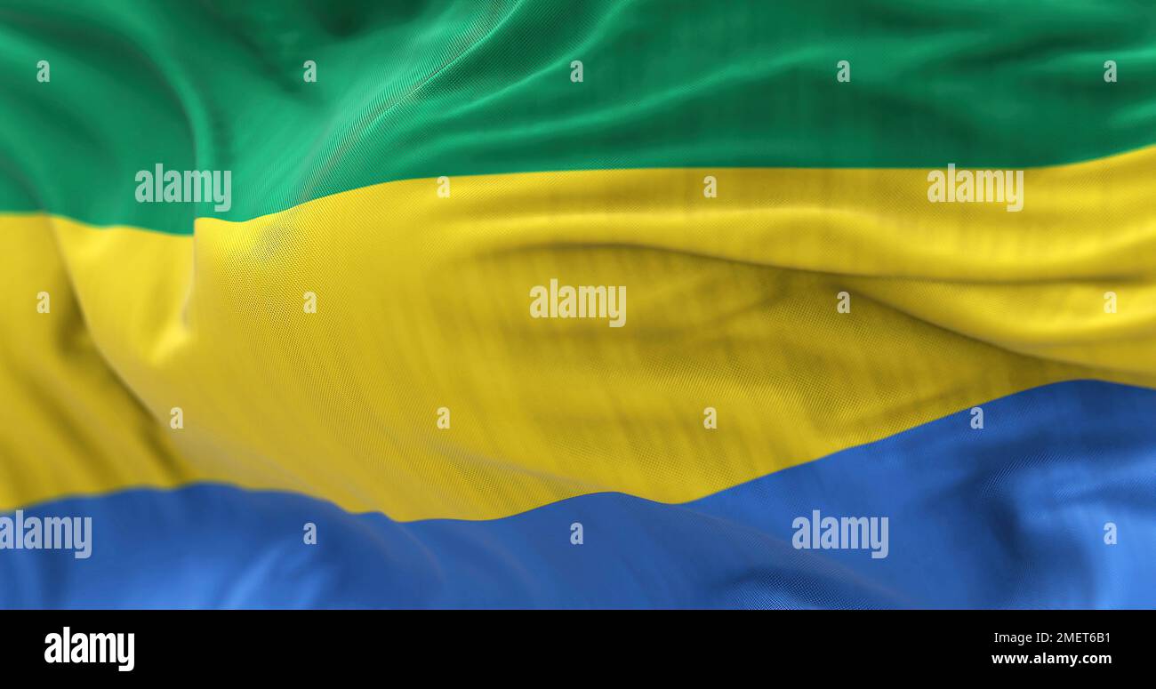 The Gabon national flag waving in the wind. The Gabonese Republic is a ...
