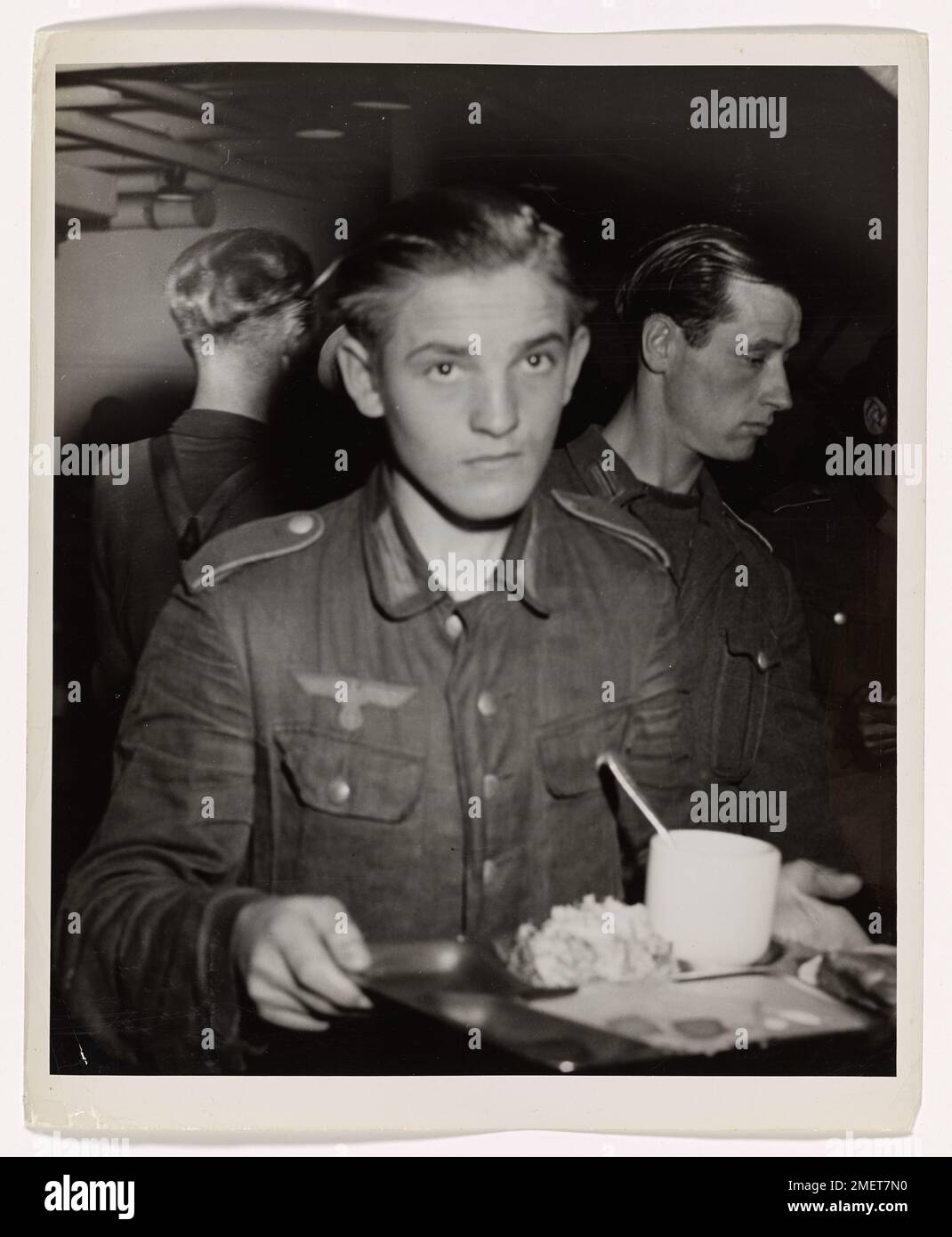 This photograph shows a German prisoner captured during the Normandy ...