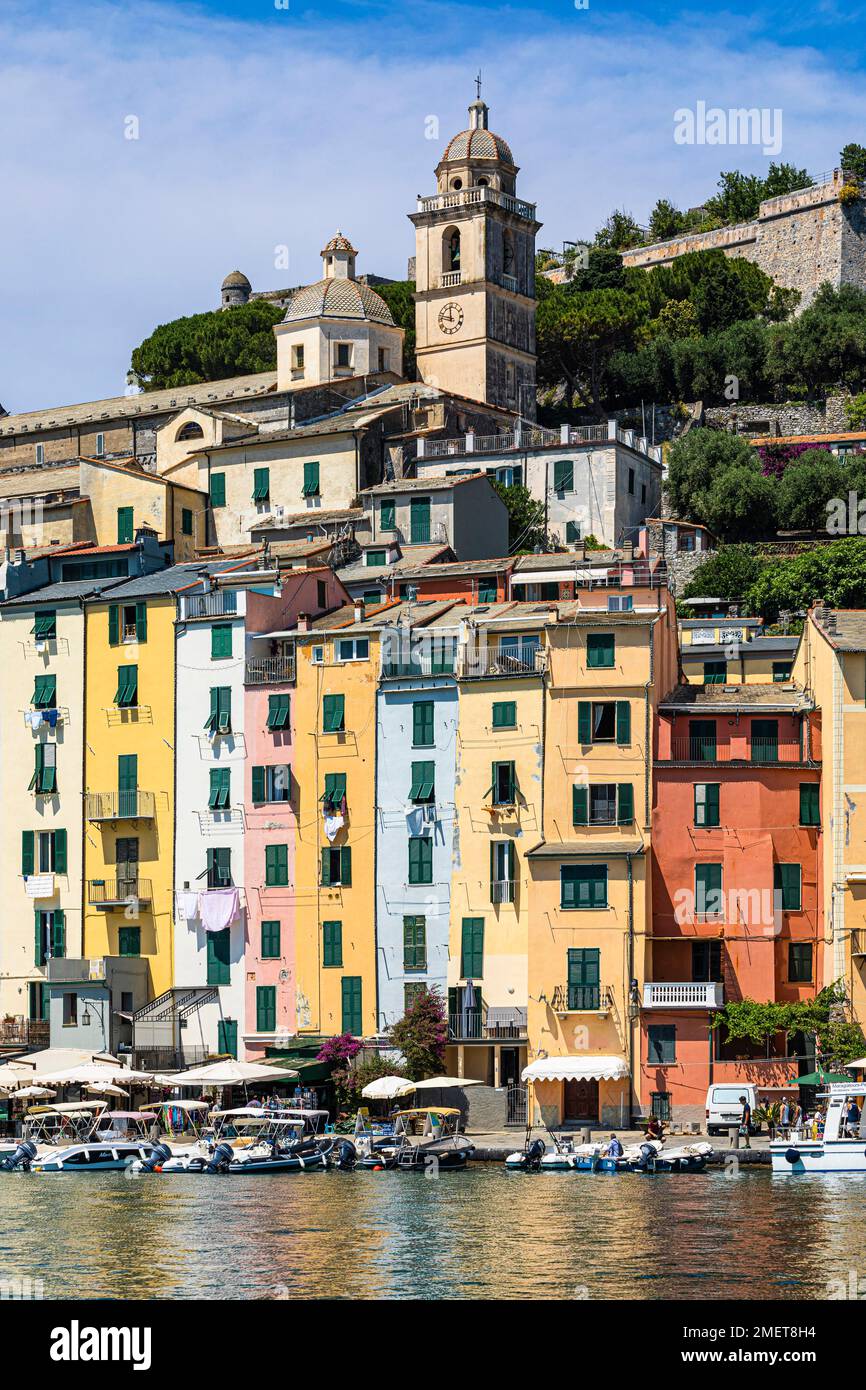 Pastel-coloured house facades in the harbour of Portovenere, behind the ...