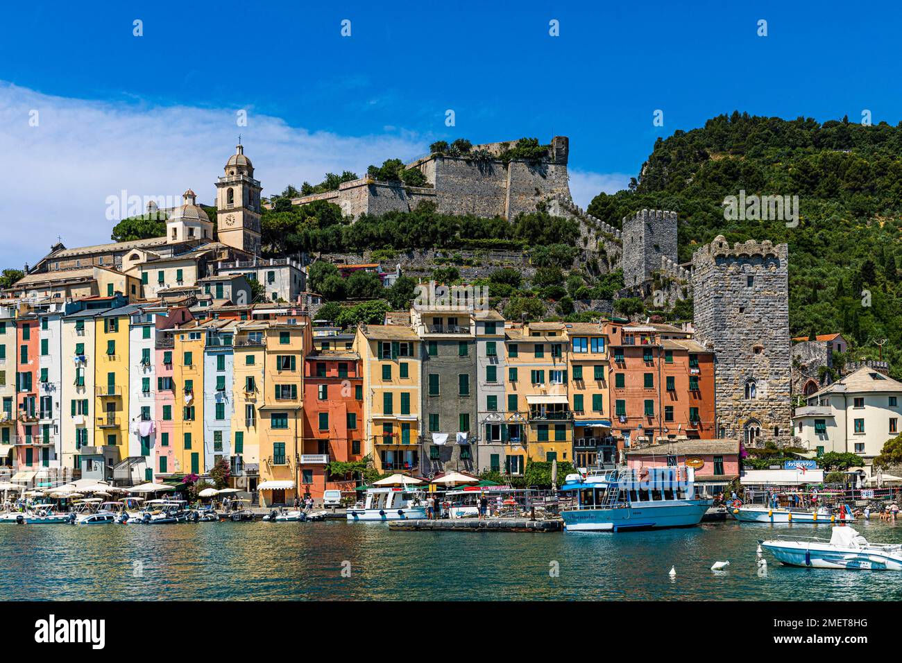 Pastel-coloured house facades in the harbour of Portovenere, behind the ...