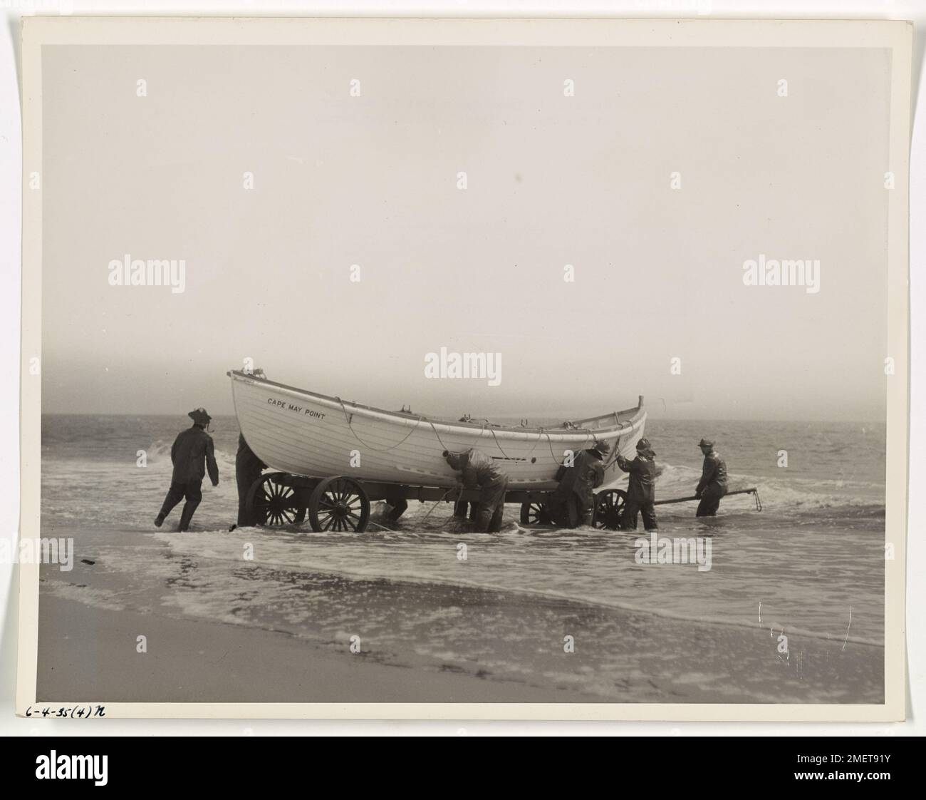 This image depicts the fourth step of launching a boat in the surf at ...