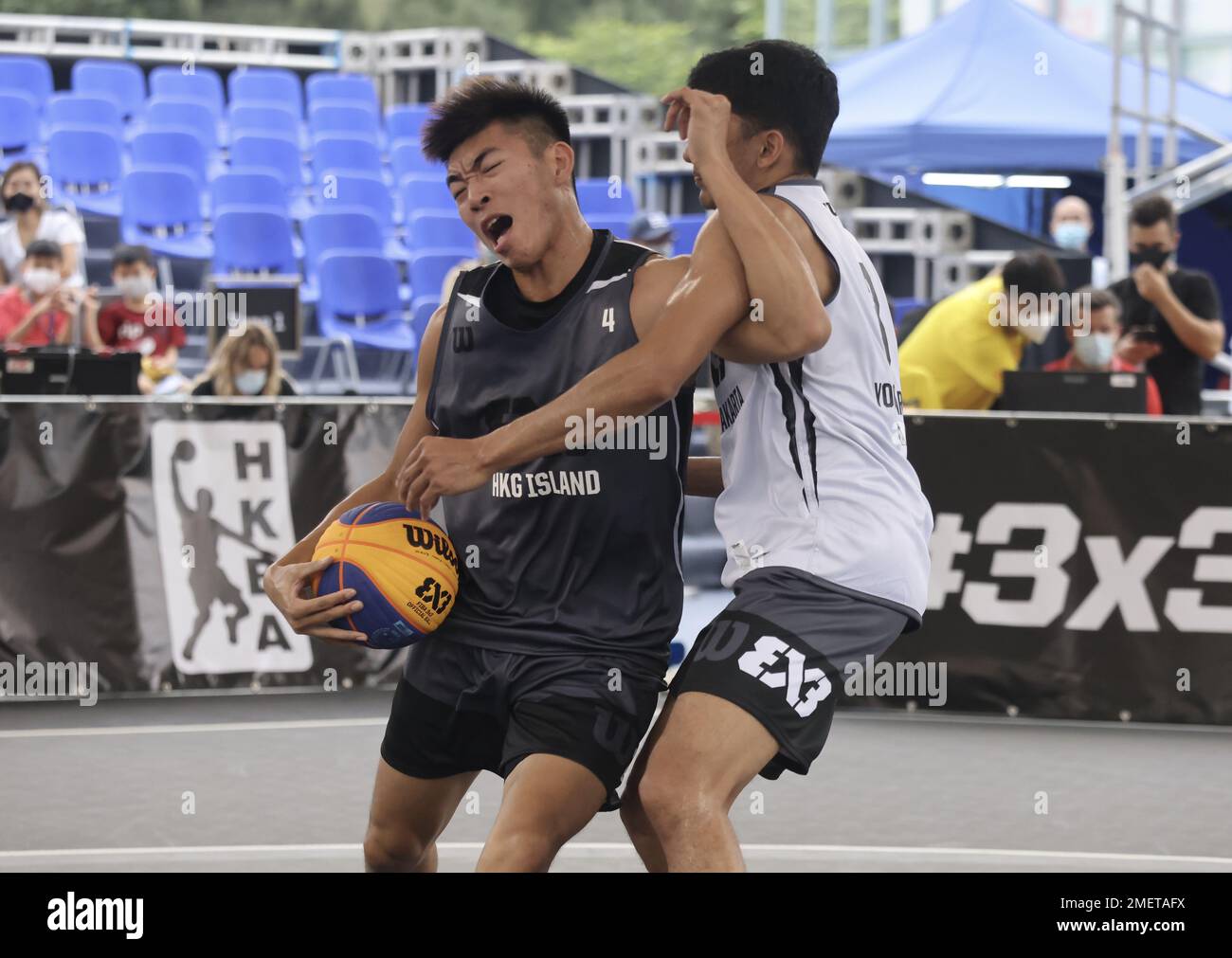 #4 Yiu Pong-yip and #3 Ikram Fadhil in action at the FIBA 3X3 World Tour Basketball match ...