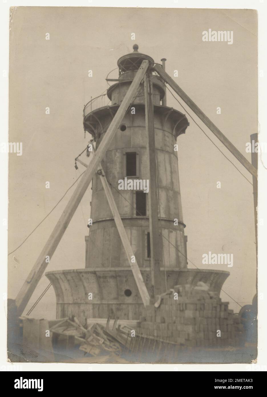 The construction of a lighthouse in a coastal region, showcasing the ...