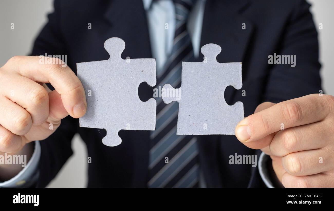 Businessman connect pieces puzzle hi-res stock photography and images ...