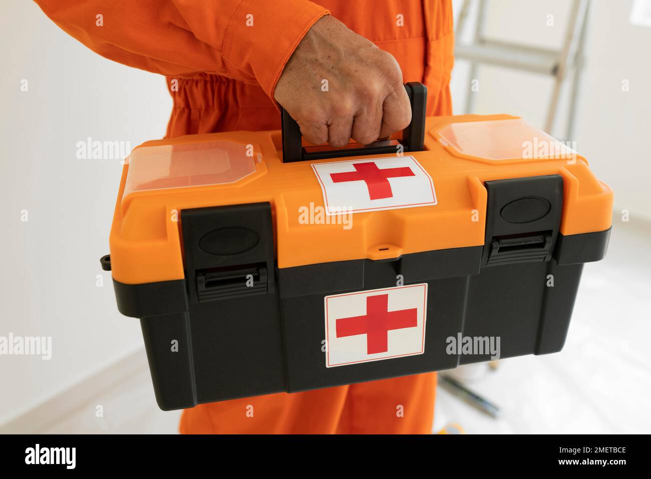 portrait man with safety protection equipment first aid kit Stock Photo ...