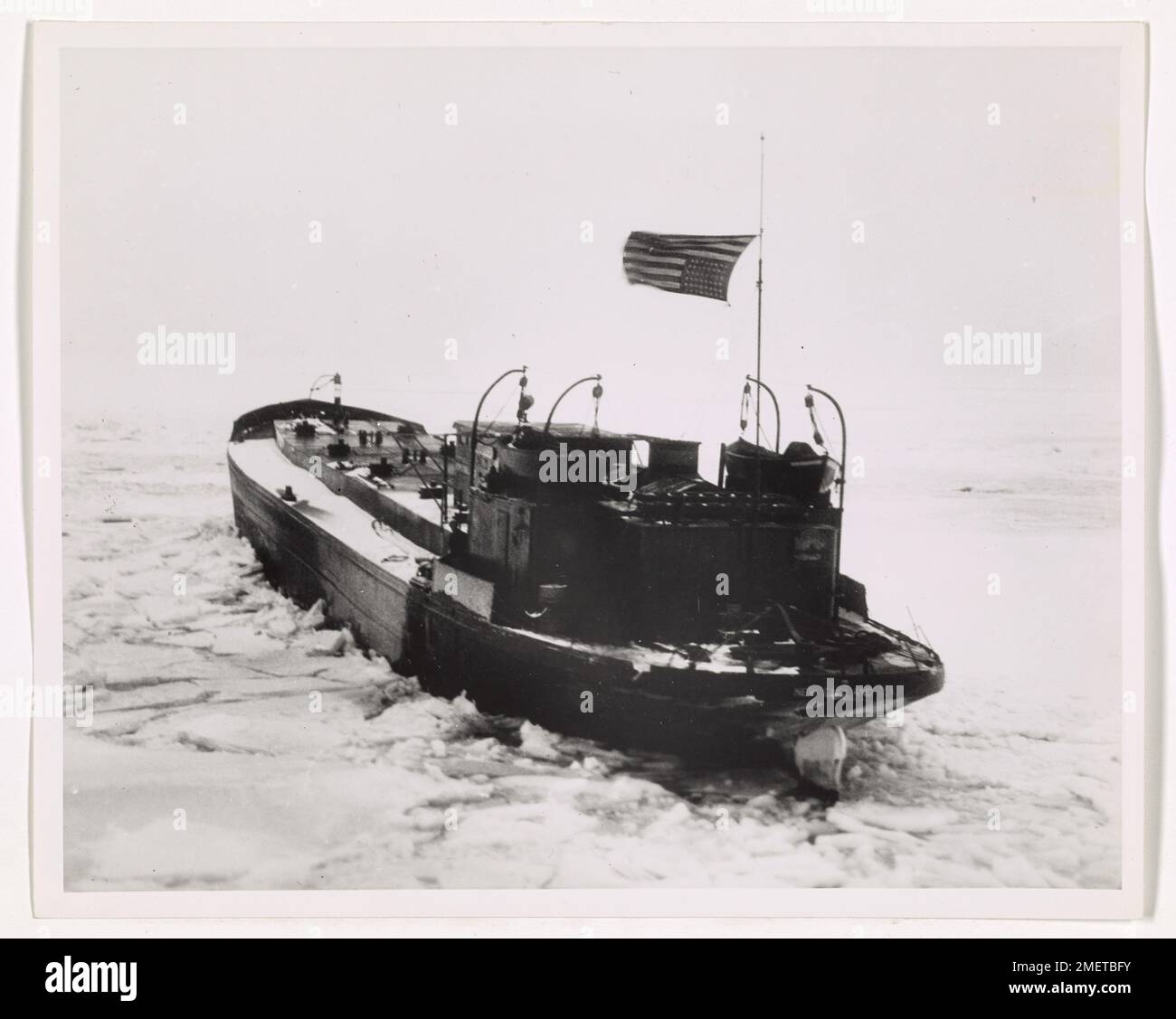 A Coast Guard vessel, the 'Comanche,' assists the barge 'New England ...