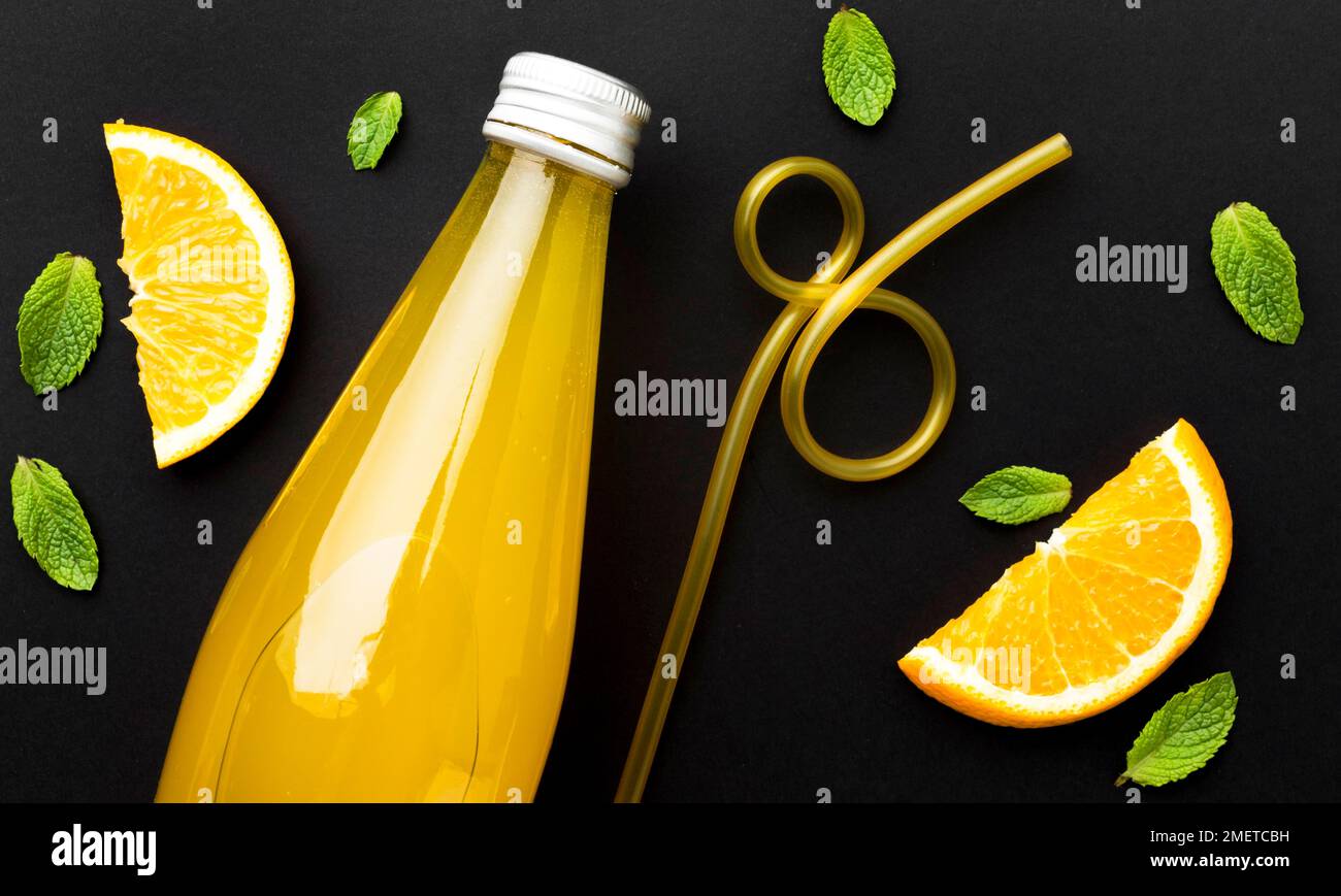 Top view bottle with soft drink orange slices Stock Photo - Alamy