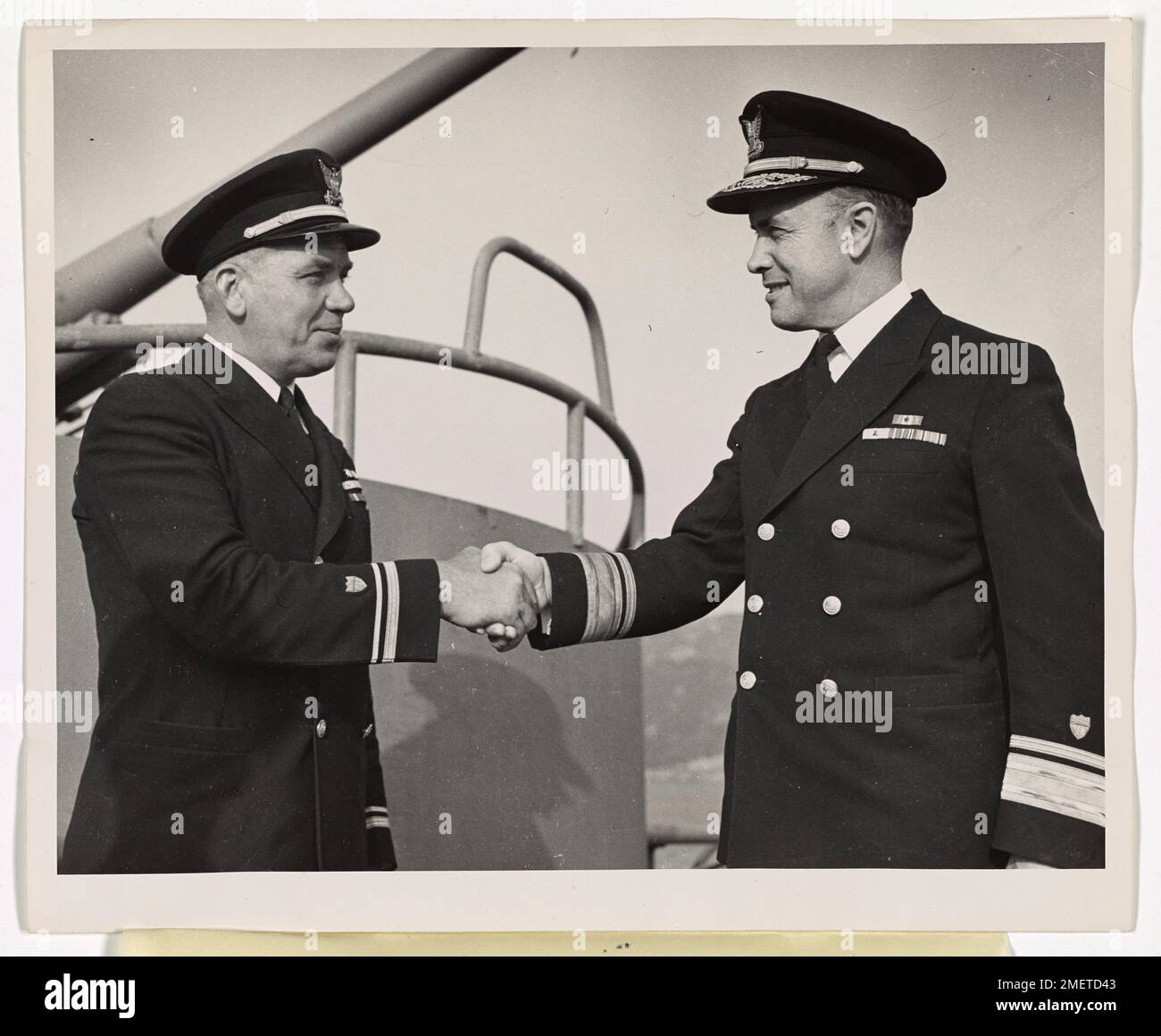 Lieutenant (j.g.) Walter Morrison is congratulated by Rear Admiral Ed H ...