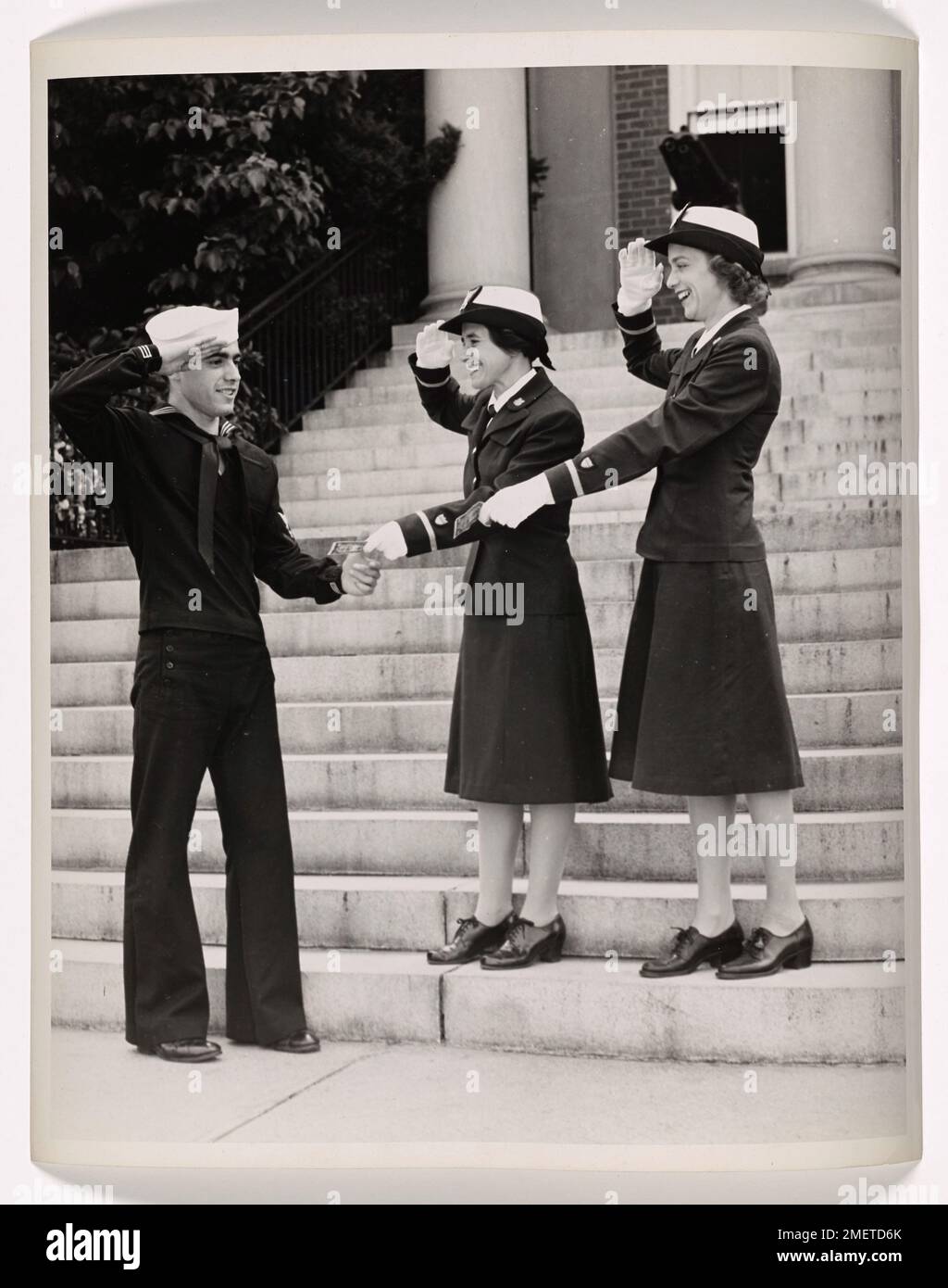 New SPAR ensigns are photographed giving a dollar to the first enlisted ...