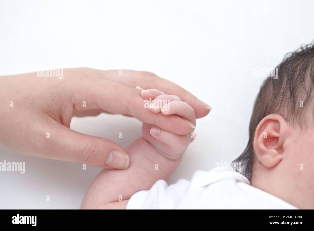 Girl holding up two fingers hi-res stock photography and images - Alamy